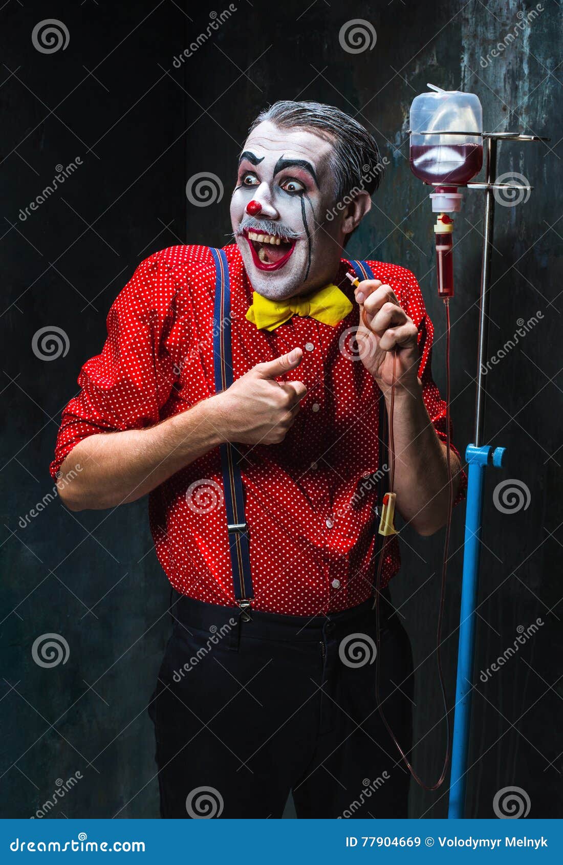 The Scary Clown and Drip with Blood on Dack Background. Halloween ...