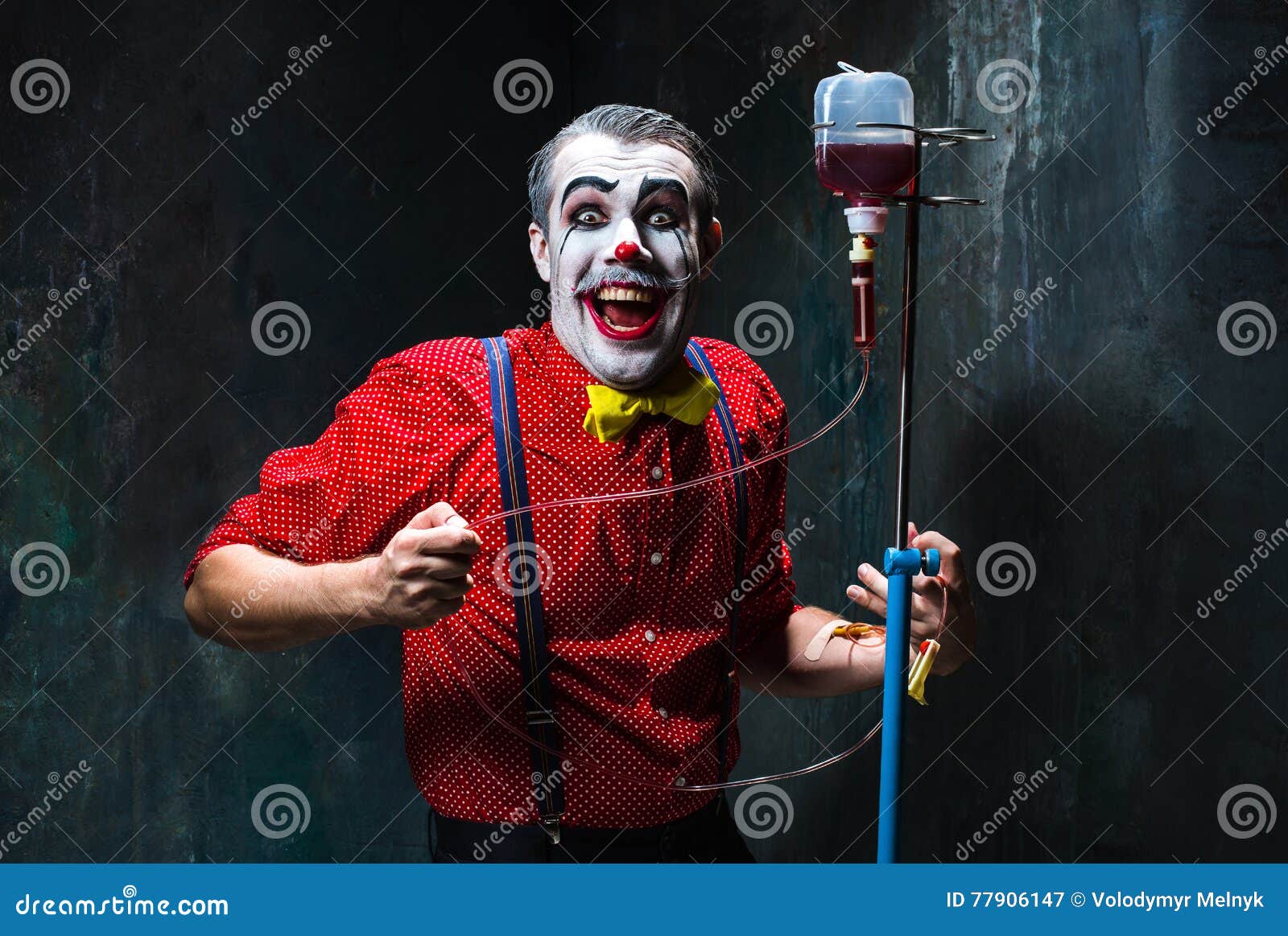 The Scary Clown and Drip with Blood on Dack Background. Halloween ...