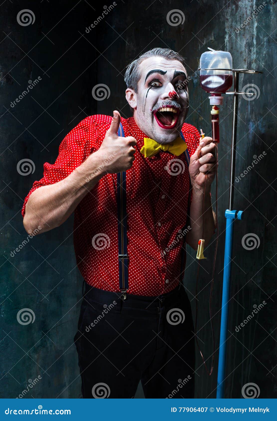 The Scary Clown and Drip with Blood on Dack Background. Halloween ...