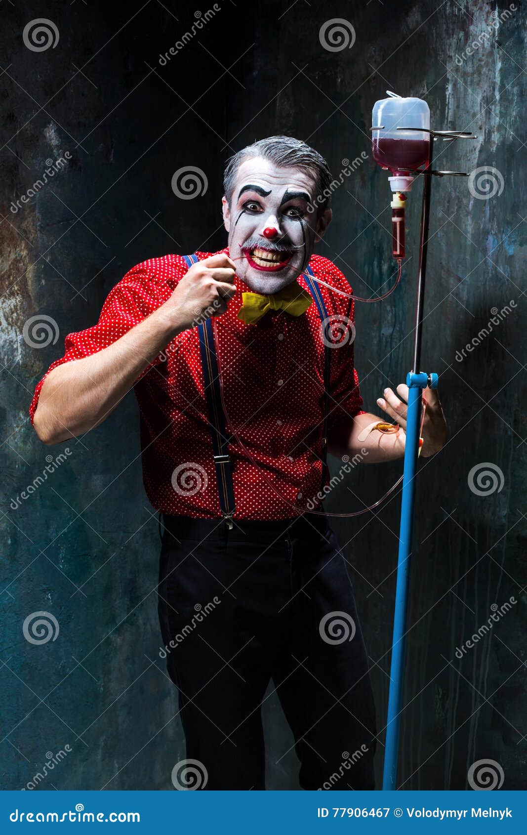 The Scary Clown and Drip with Blood on Dack Background. Halloween ...