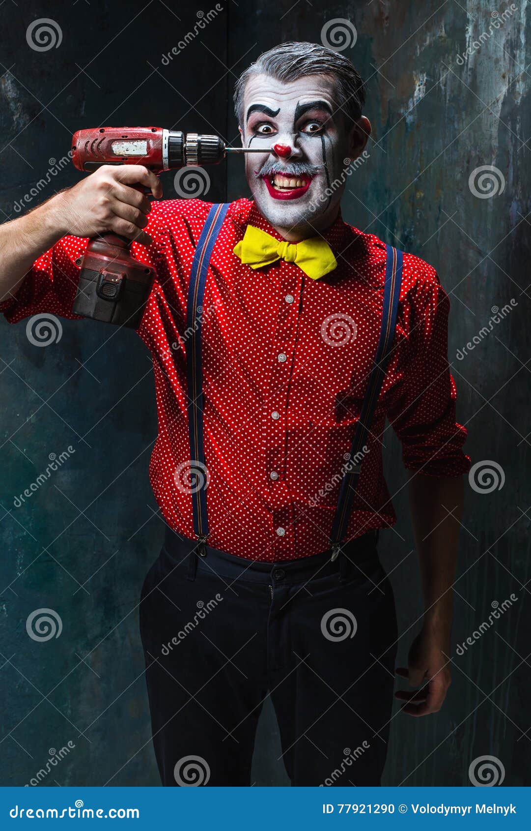 The Scary Clown and Electric Drill on Dack Background. Halloween ...