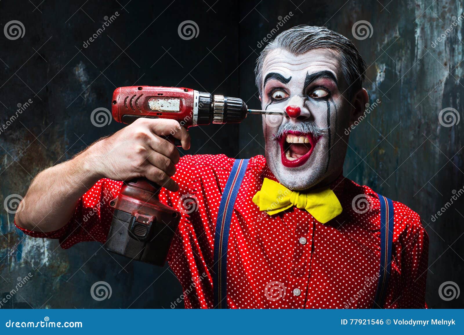 The Scary Clown and Electric Drill on Dack Background. Halloween ...