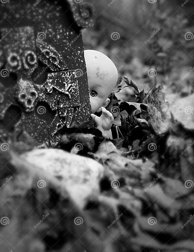 Scary doll in cemetery stock image. Image of skeletal - 19816459