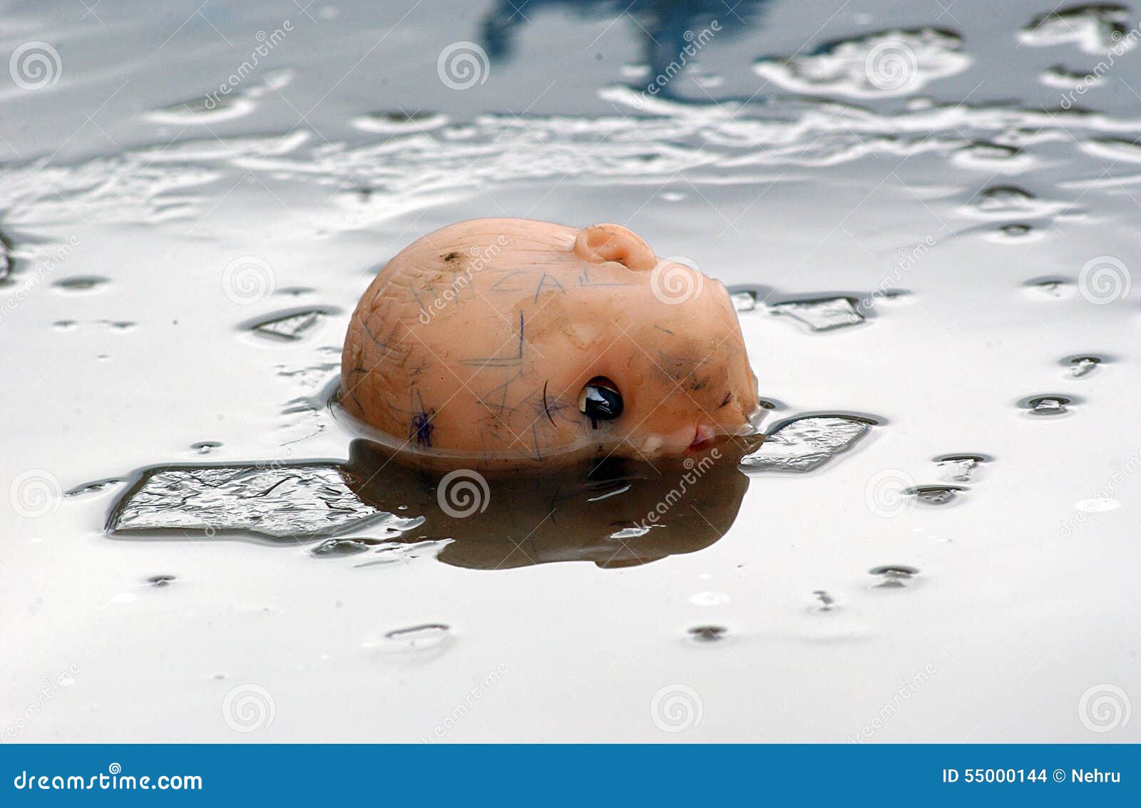 Scary Doll Head On A Ice Cold Water, Horror Royalty-Free Stock Image ...