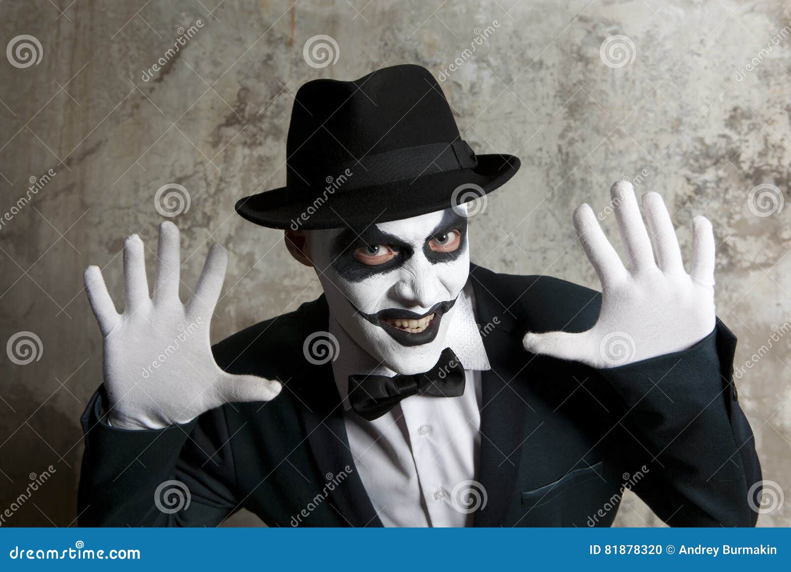 Scary Evil Clown Wearing a Bowler Hat on Wall Stock Photo - Image of ...