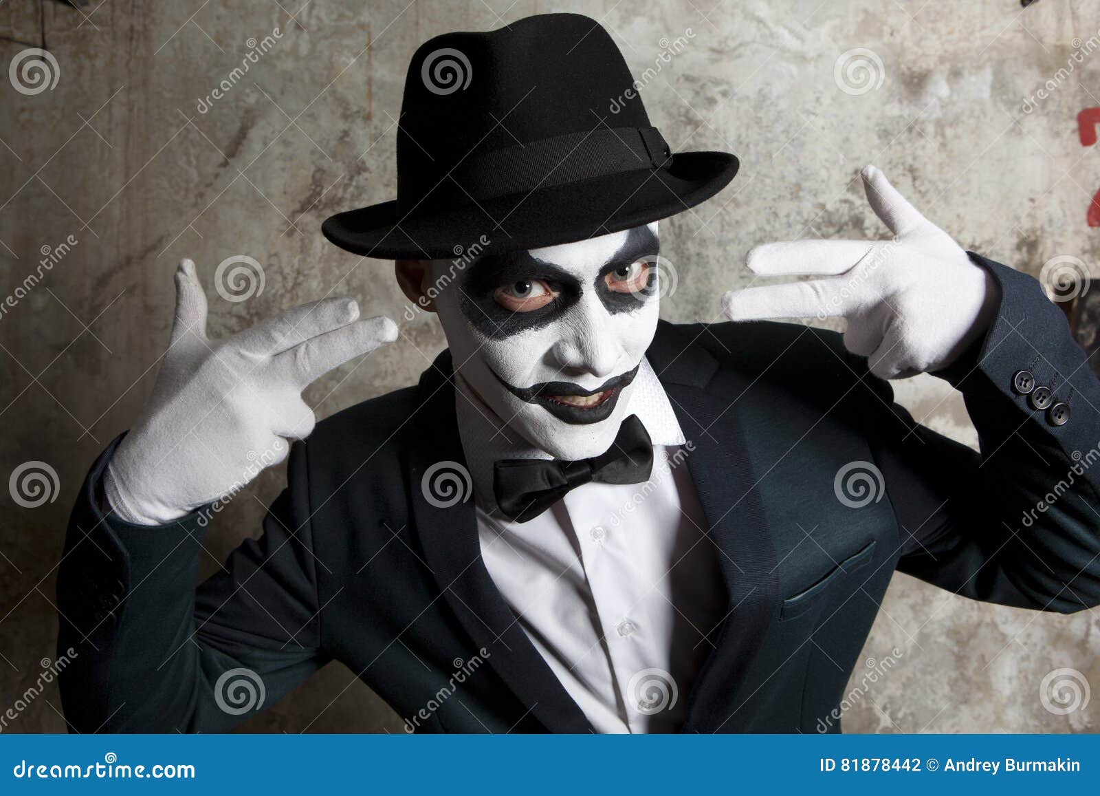 Scary Evil Clown Wearing a Bowler Hat on Wall Stock Photo - Image of ...