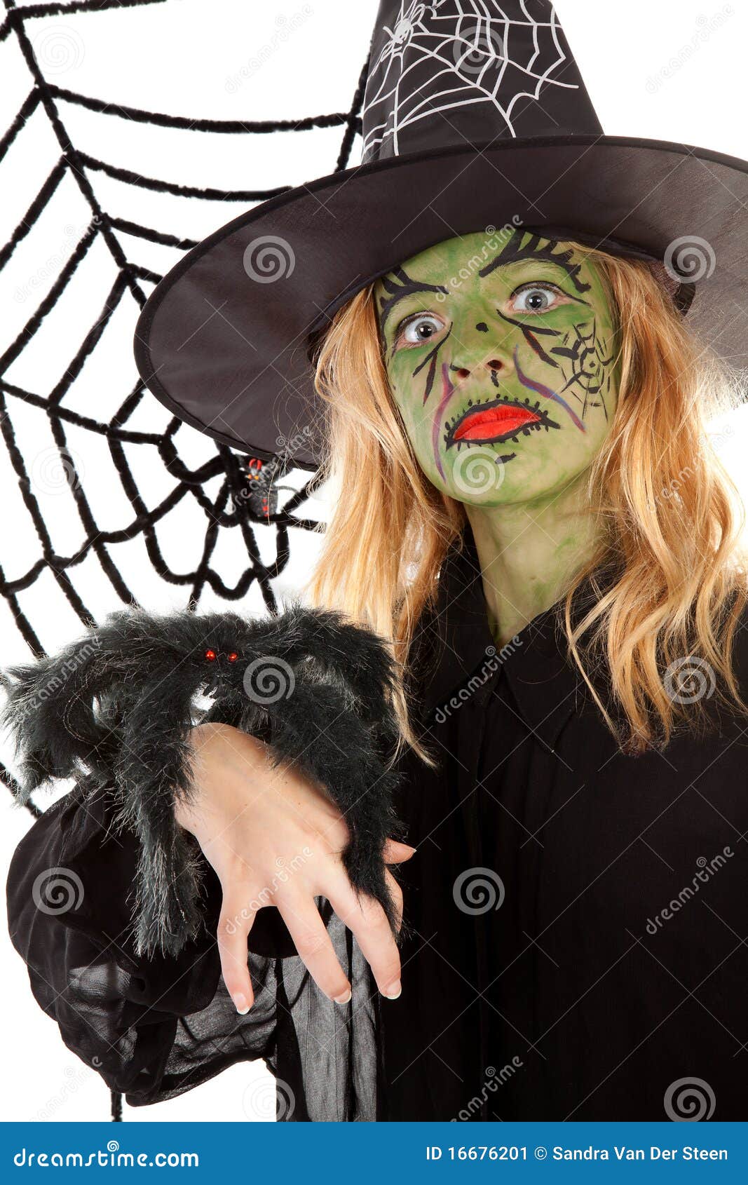 The Scary Green Face Witch With Black Outfit And Pointed Hat In Front ...