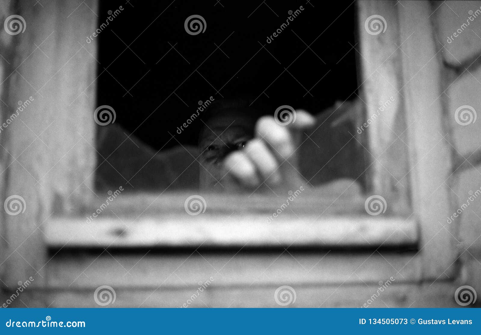 Scary hand in the window. stock image. Image of window - 134505073