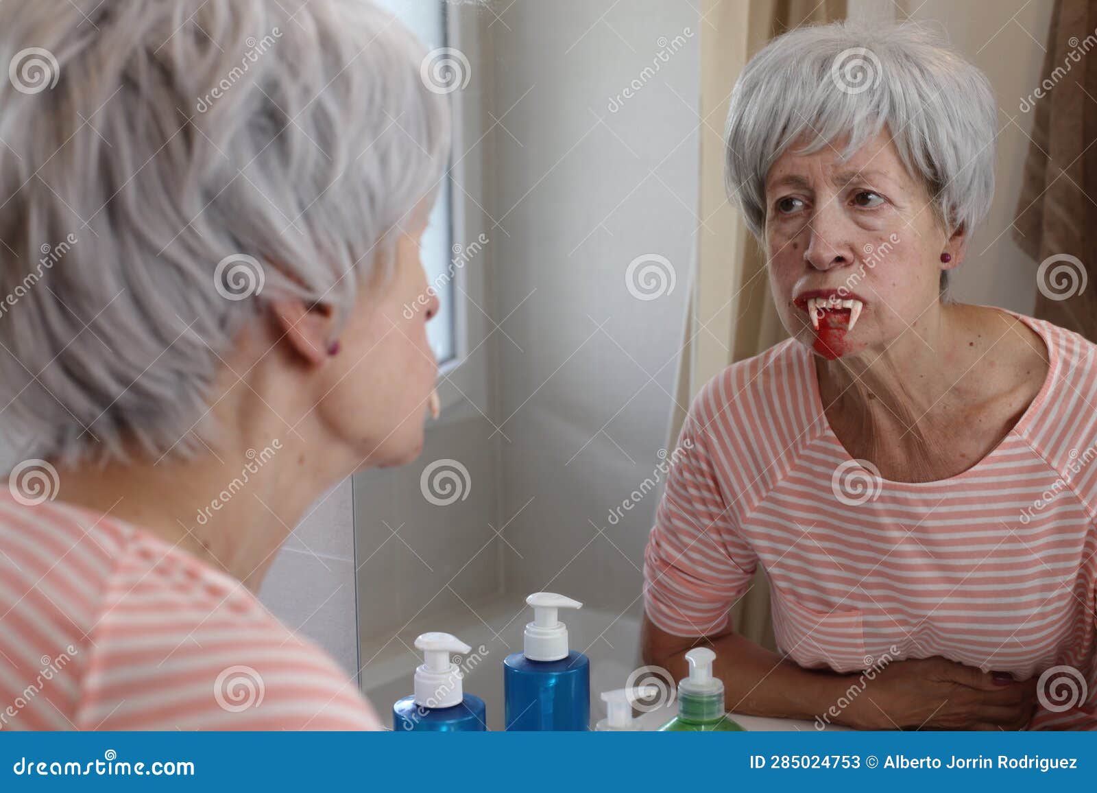 Scary Senior Vampire Looking at Her Mirror Reflection Stock Image ...