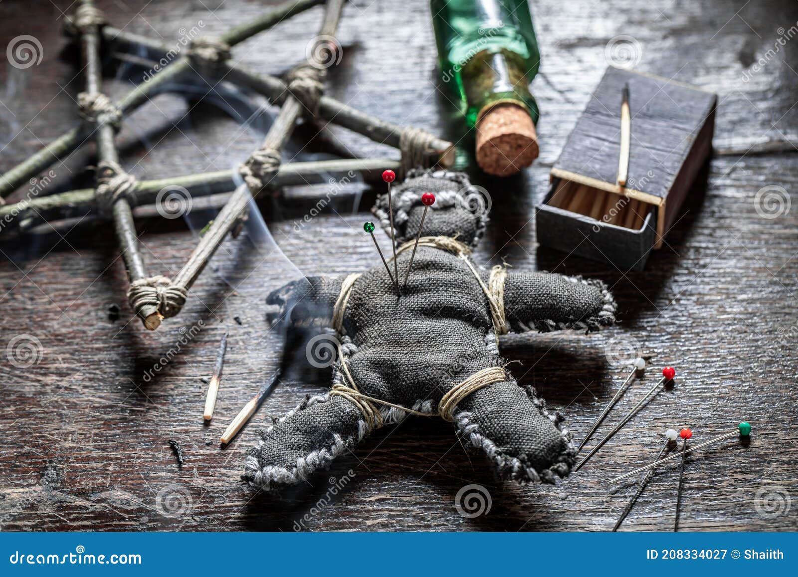 Voodoo Doll Burned with Fire and Pierced by a Needle Stock Image ...