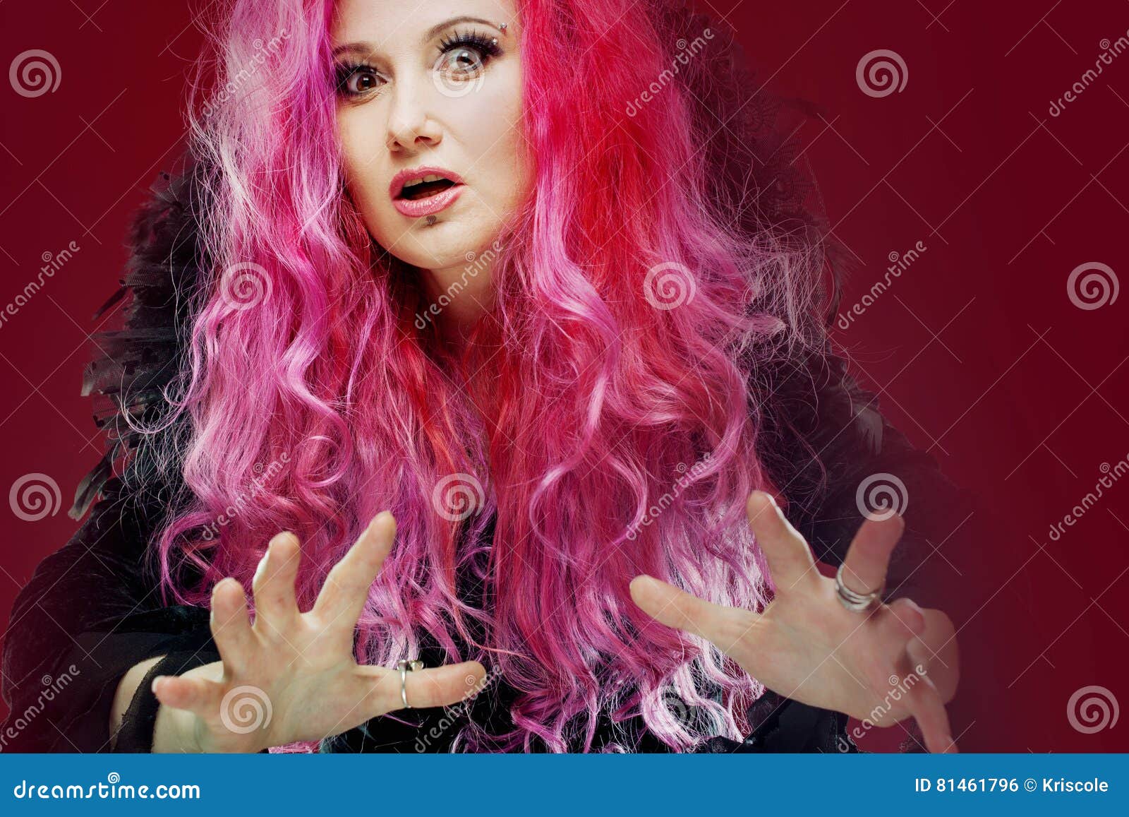 Scary Witch with Red Hair Performs Magic. Halloween. Stock Photo ...