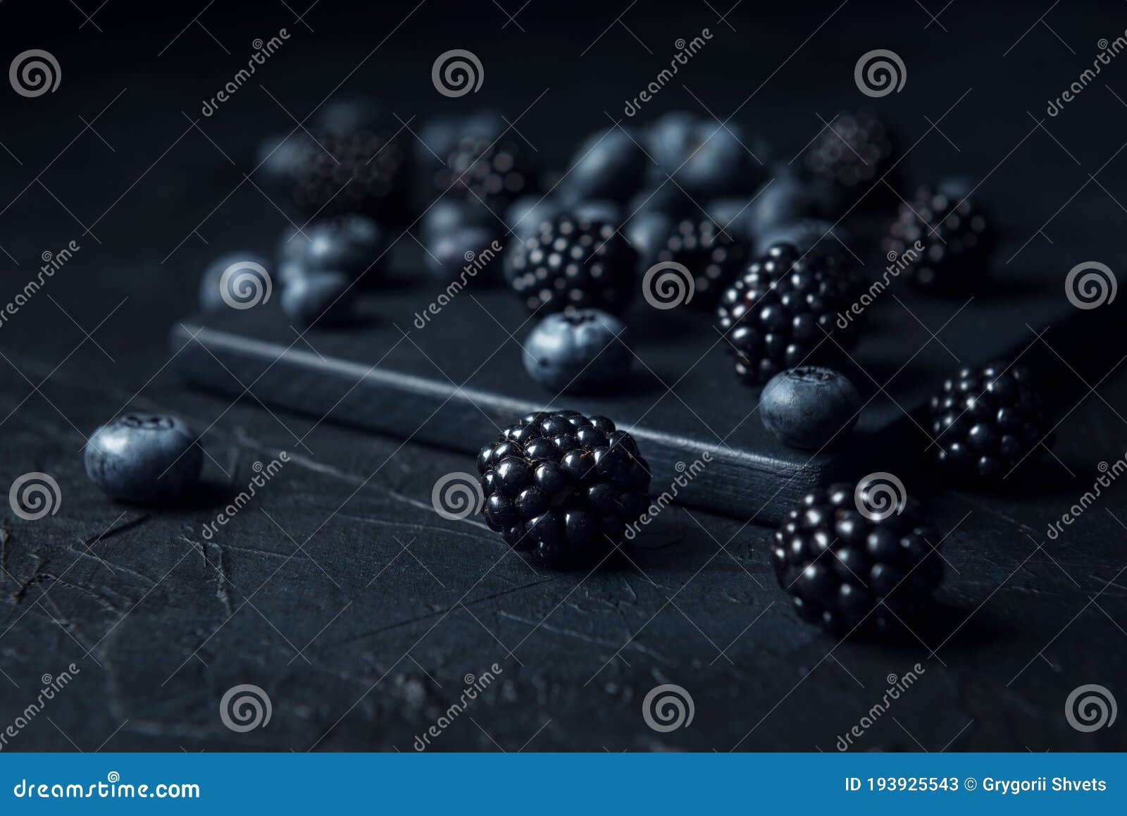 Scattered Blueberry and Blackberry on Dark Textured Background Stock ...