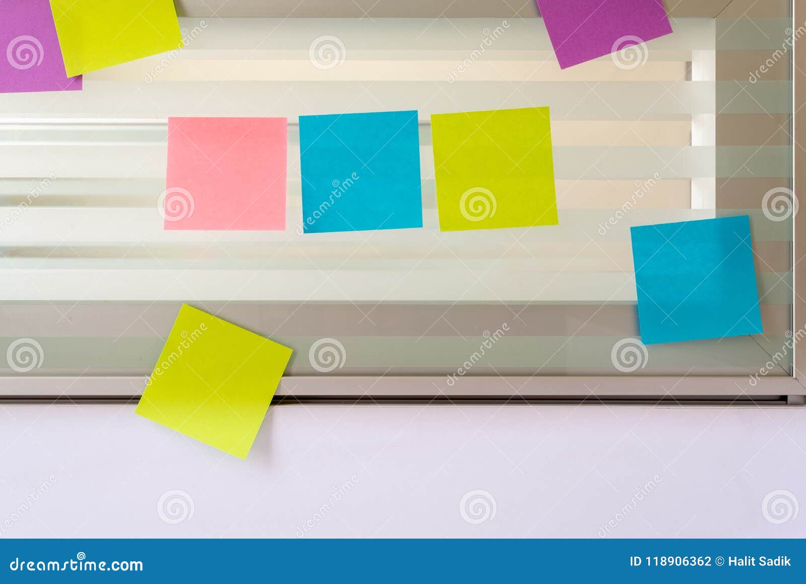 Scattered Colored Sticky Notes Over Glass Screen of a Bench Desk Stock ...