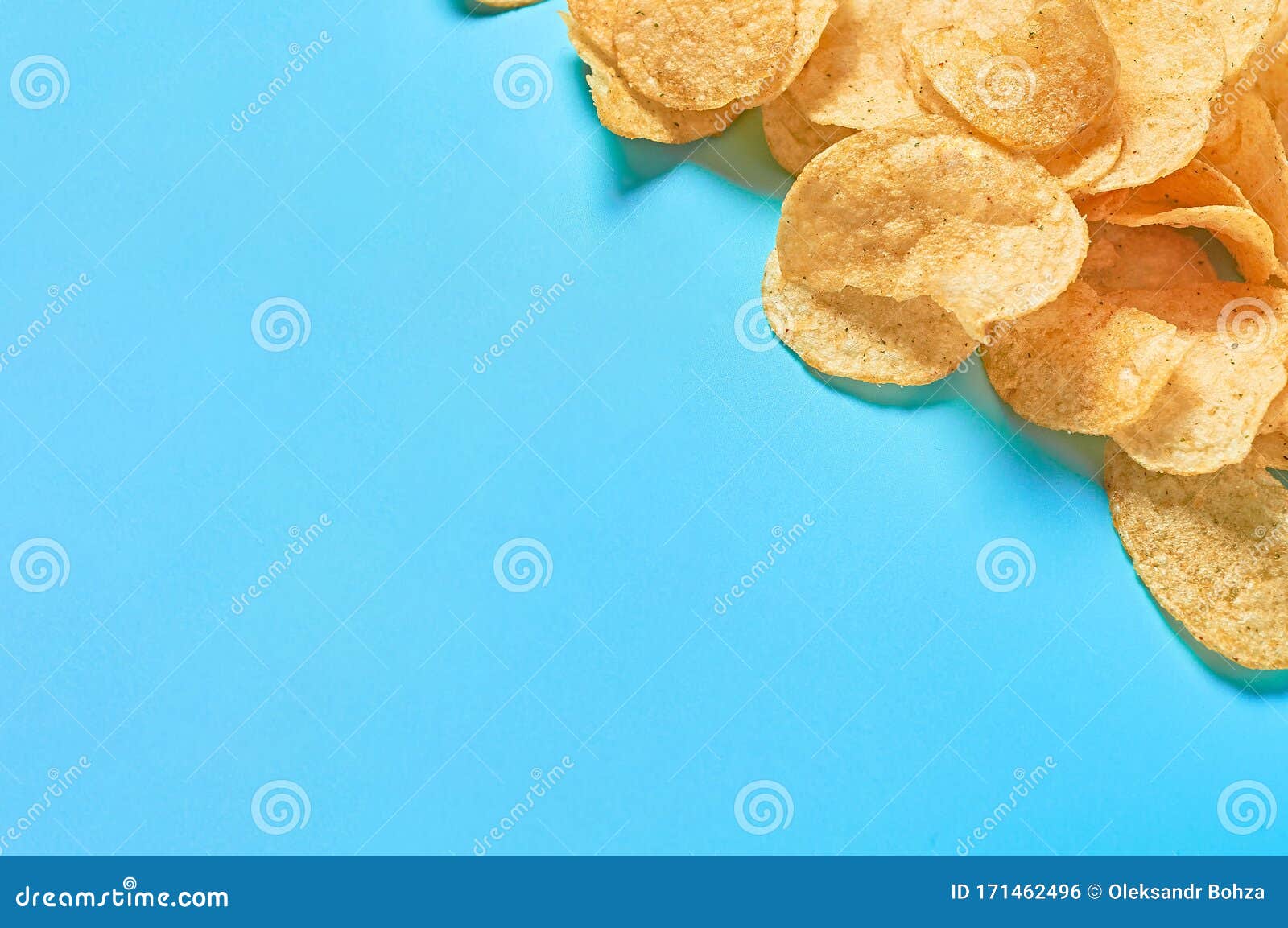 Scattered Many Fried Potato Chips on Blue Background Stock Photo ...