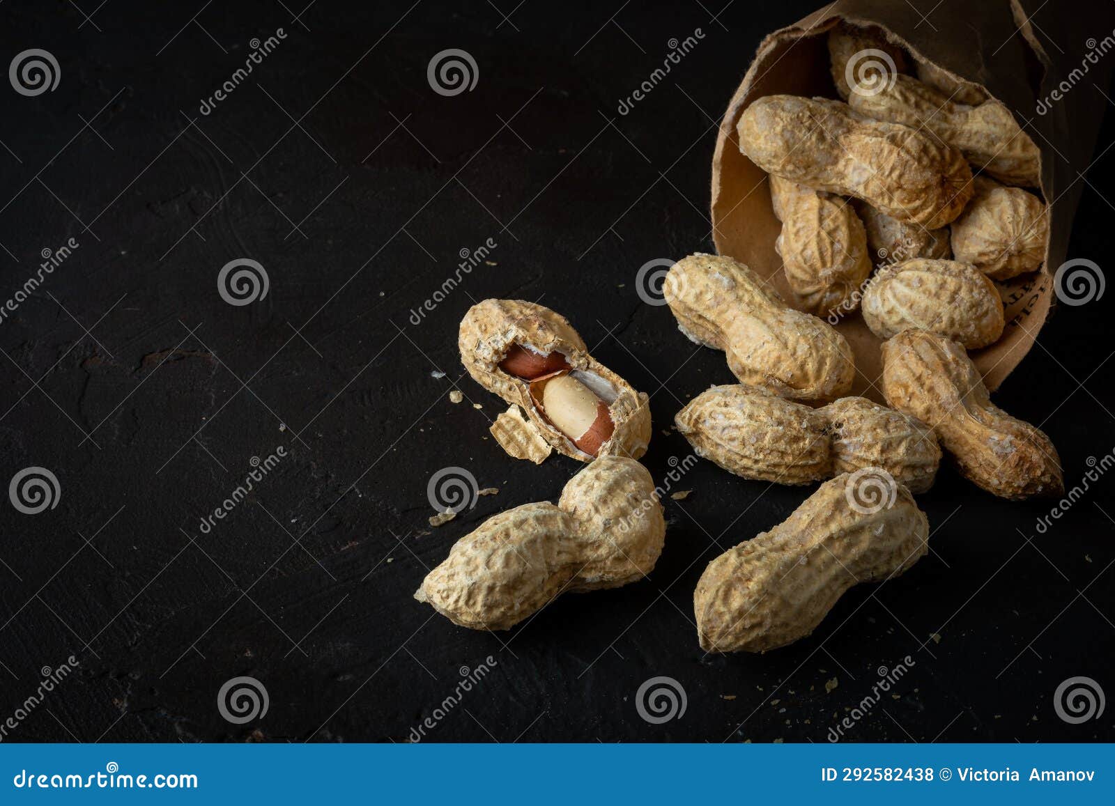 Scattered Peanuts from a Paper Envelope on a Black Background Stock ...