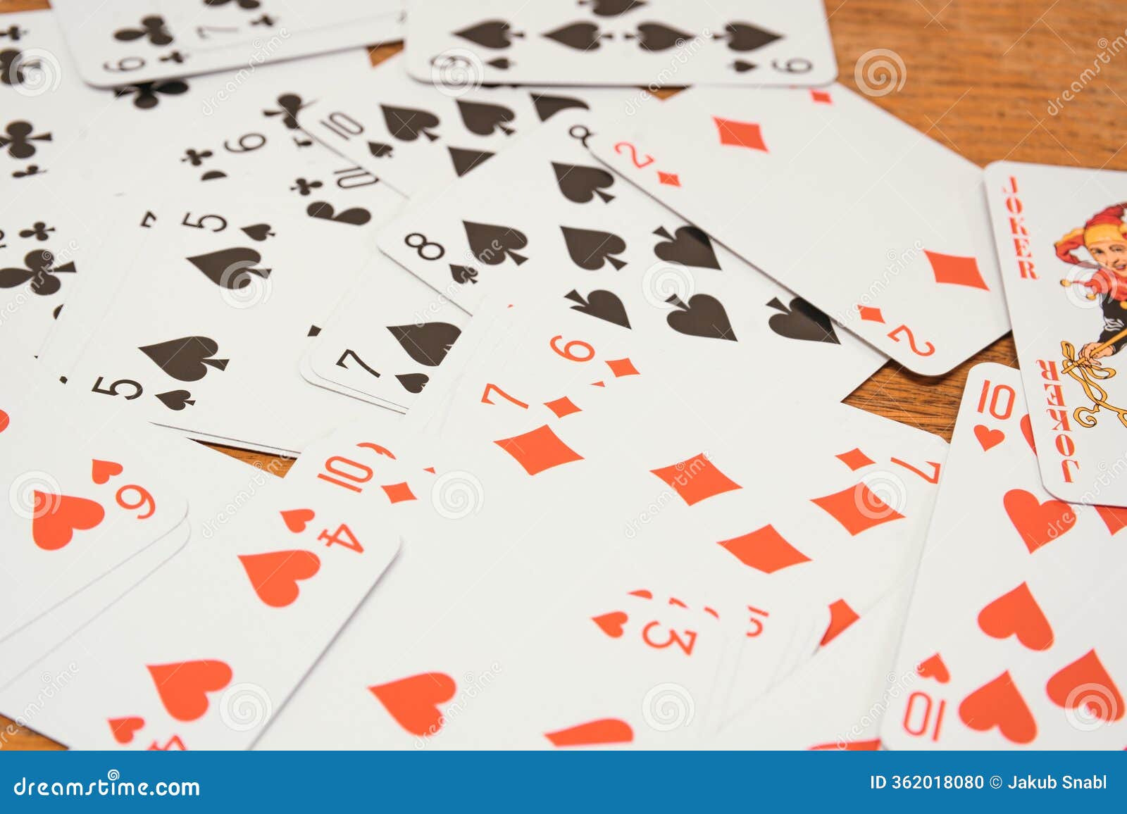 Scattered Playing Cards on Wooden Table Stock Photo - Image of deck ...