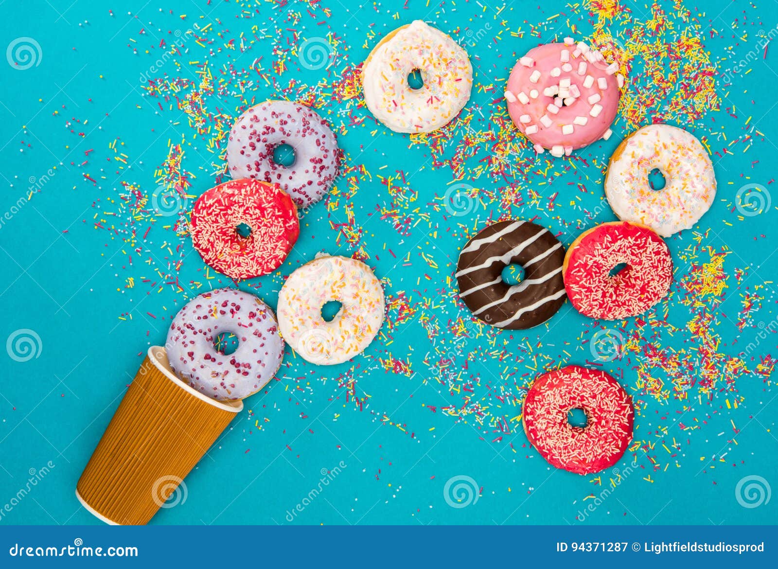 Scattered Several Donuts with Various Glaze. Donuts Isolated on Blue ...