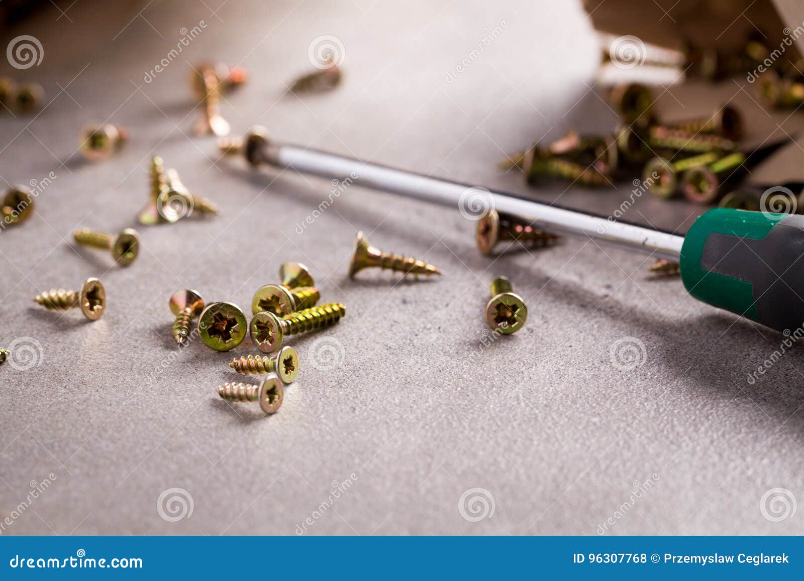 Scattered small screws. stock photo. Image of metallic - 96307768