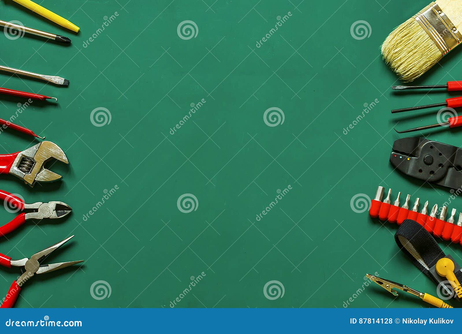 Scattered Tools for Electronics Repair on a Green Background Stock ...