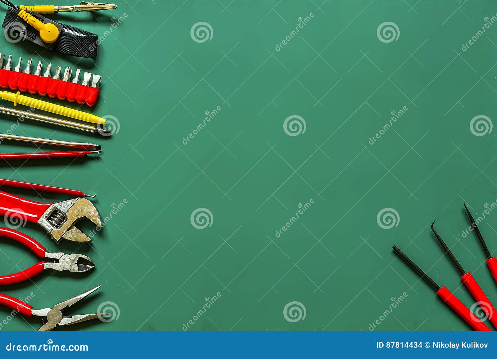 Scattered Tools for Electronics Repair on a Green Background Stock ...