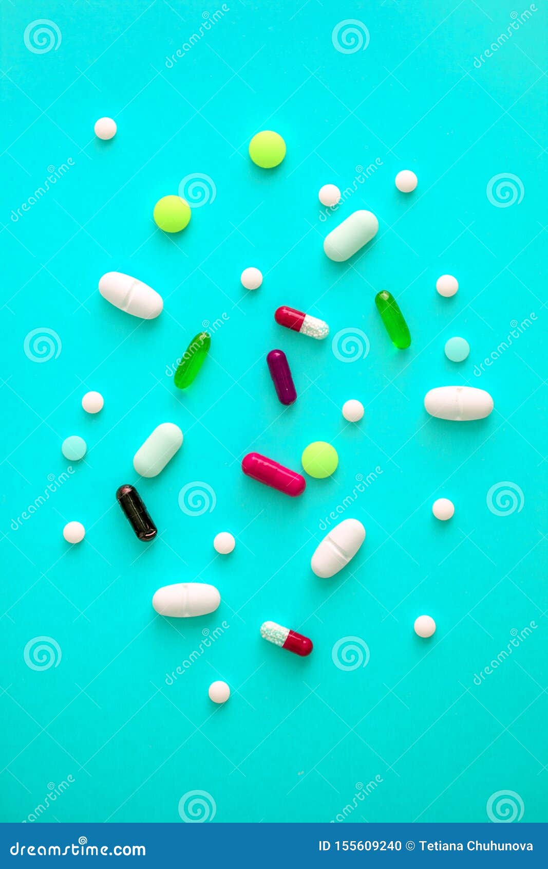 Scattered Various Colored Tablets in a Blue-cyan Background. View from ...