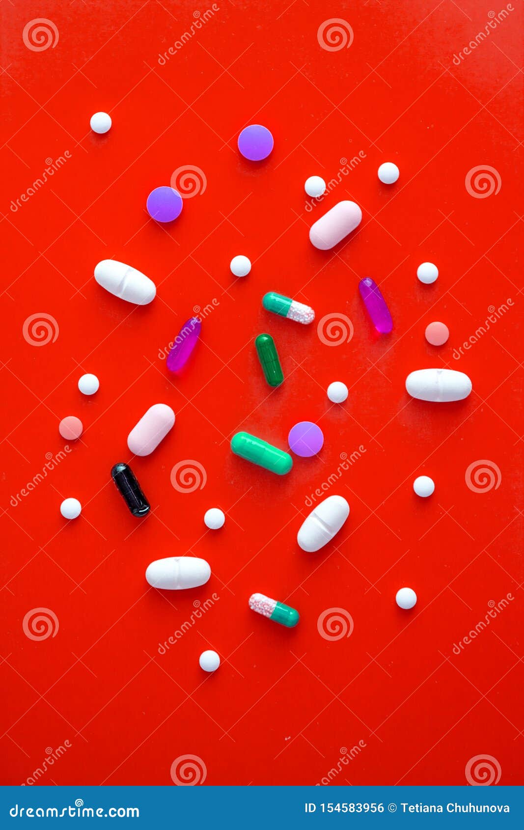 Scattered Various Colored Tablets in a Red Background. View from Above ...