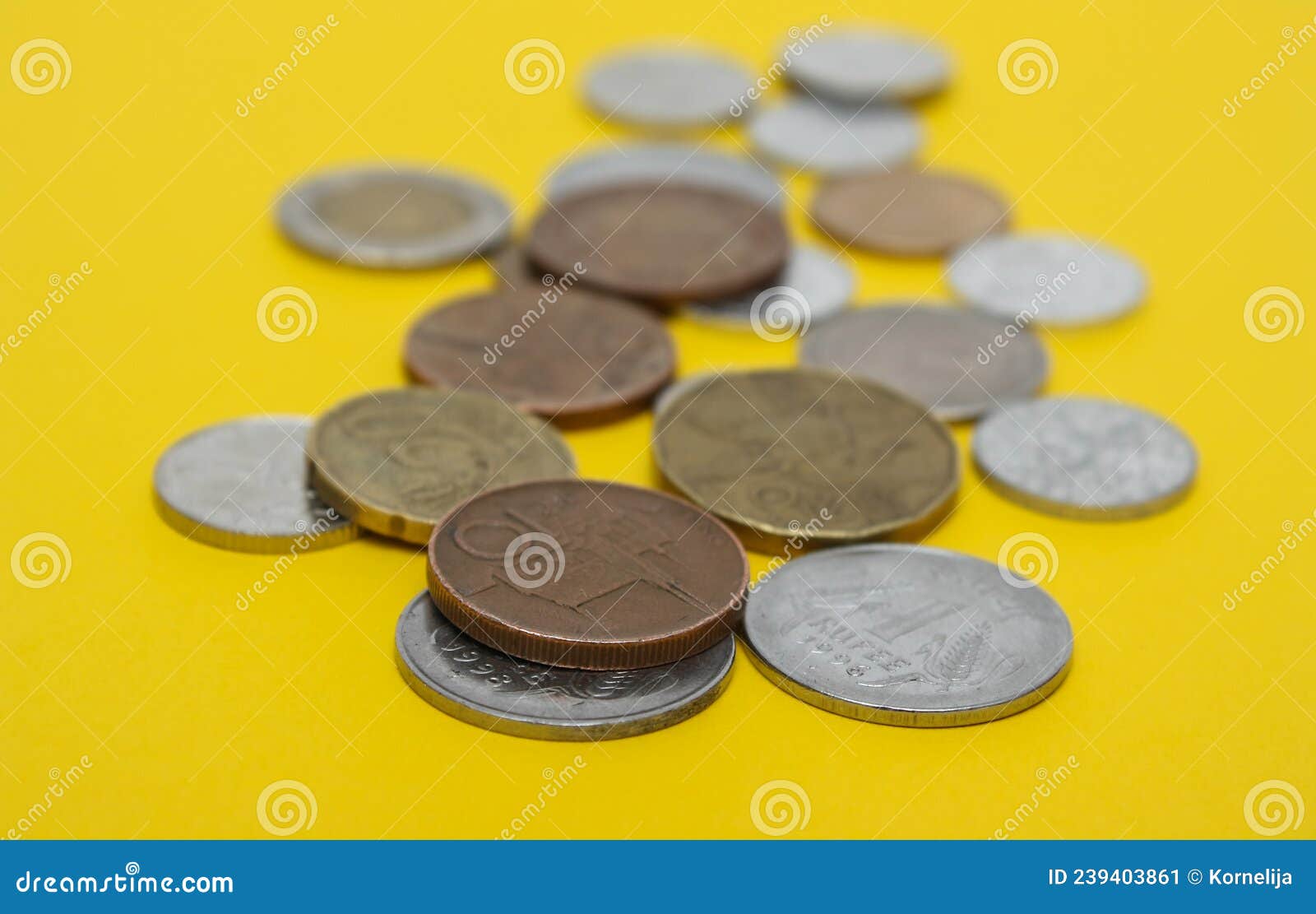 A Scattering of Coins on the Yellow Background Stock Image - Image of ...