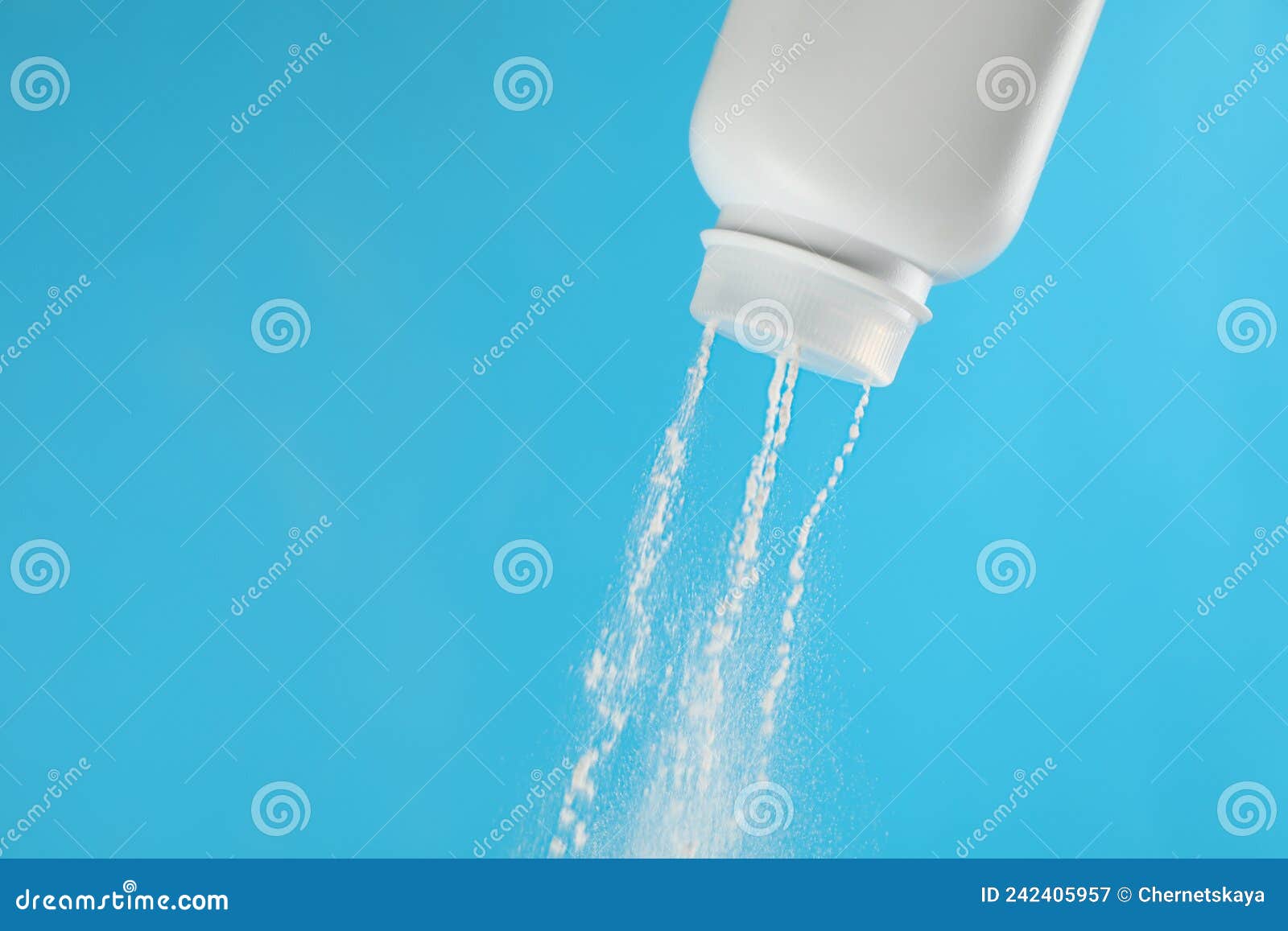 Scattering of Dusting Powder on Light Blue Background, Space for Text ...