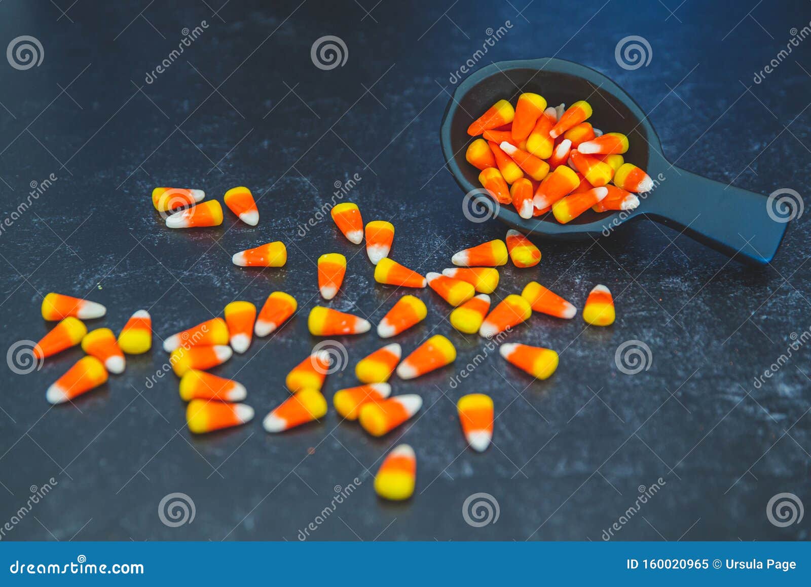 Scattering of Halloween Fall Autumn Candy Corn on a Black Slate Surface ...