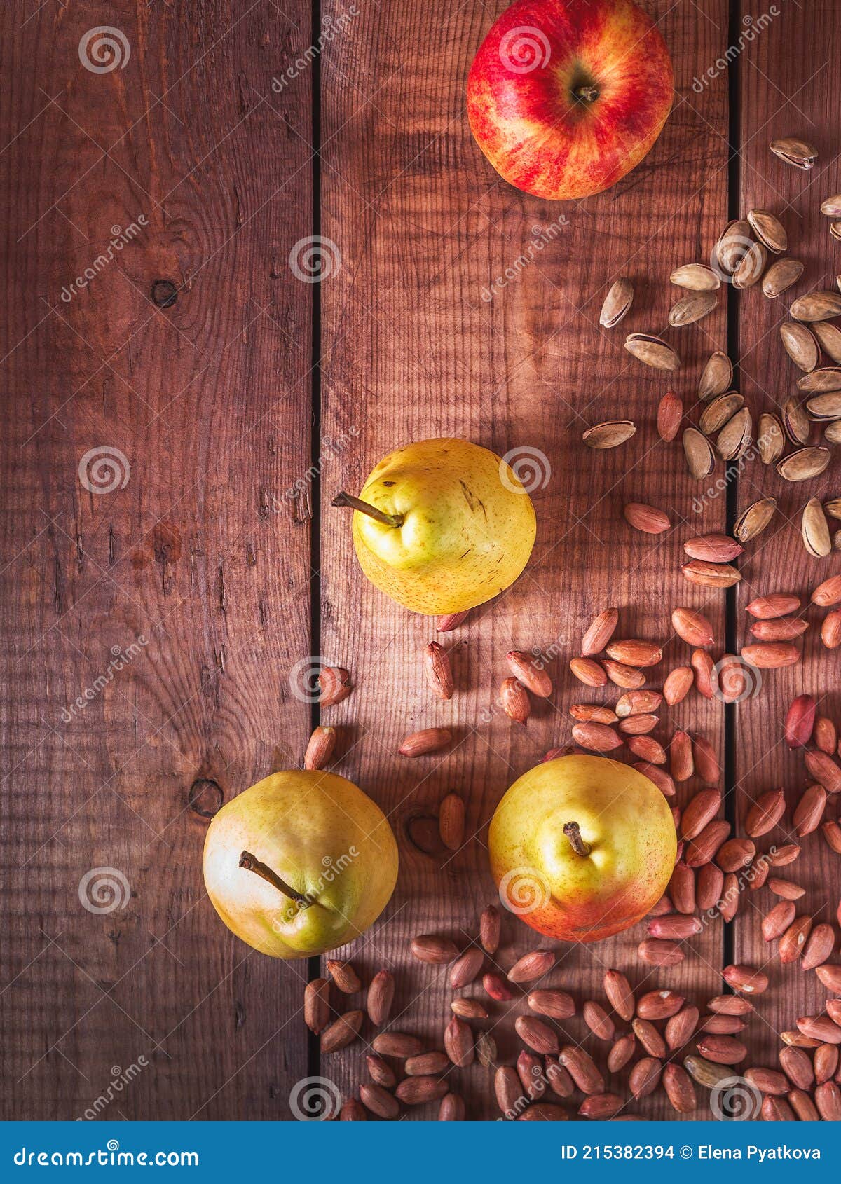 Scattering of Pistachios and Peanuts, Pears and Apples on the Table ...