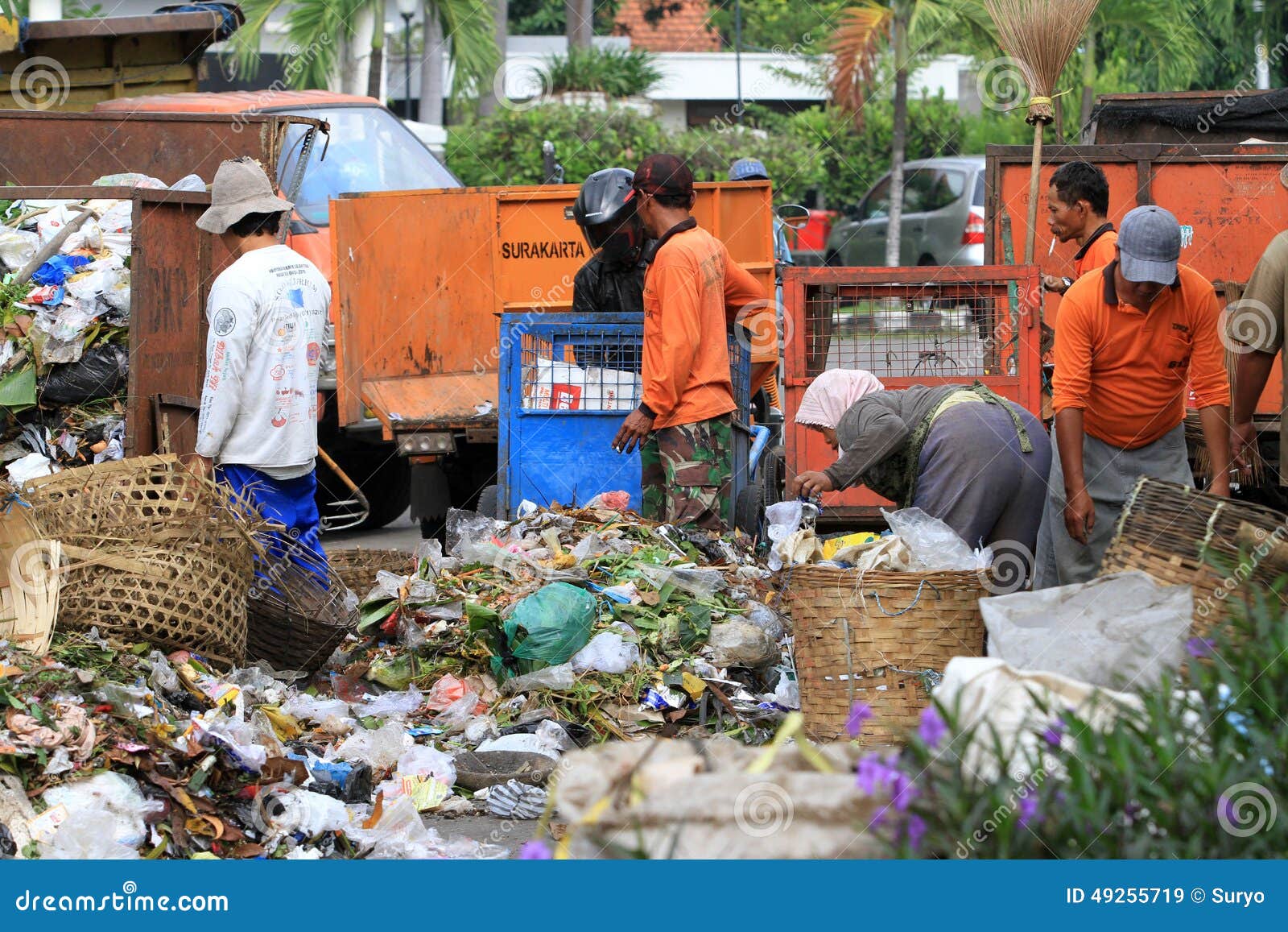 Scavenger Sorting Through Trash At A Dump Site In Manila, Philippines ...