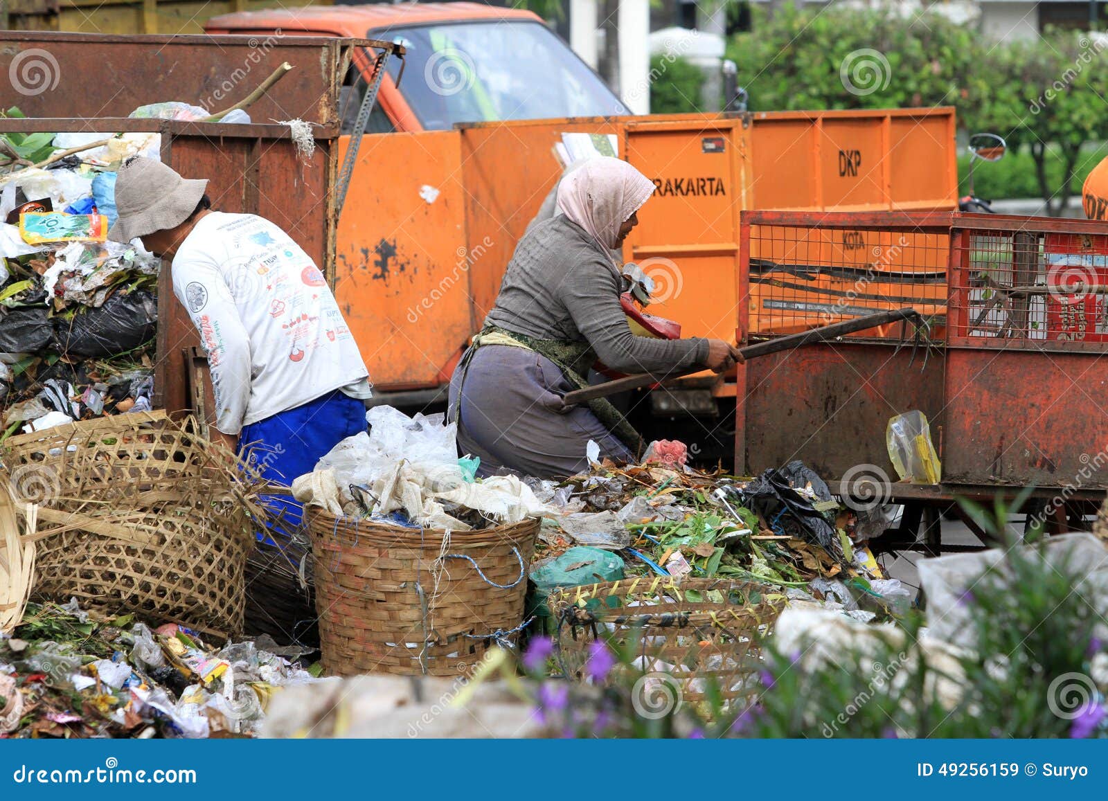 Scavenger Sorting Through Trash At A Dump Site In Manila, Philippines ...