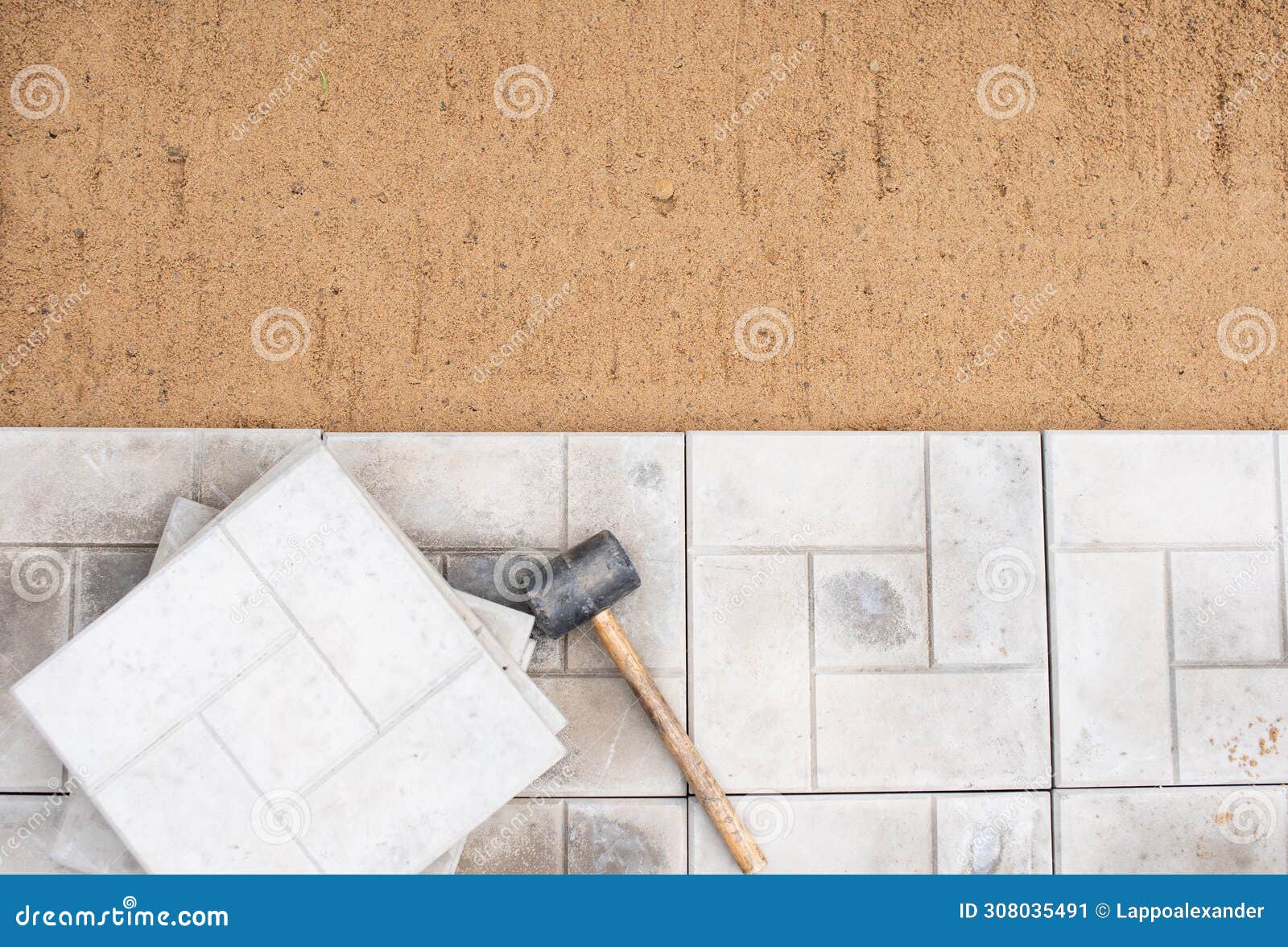 Scene of an Ongoing Pavement or Tile Installation. There is a Rubber ...