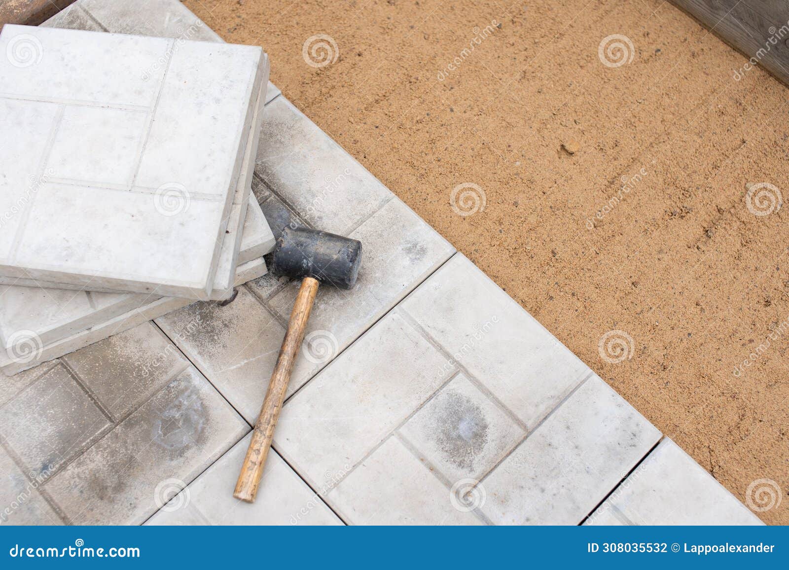 Scene of an Ongoing Pavement or Tile Installation. There is a Rubber ...