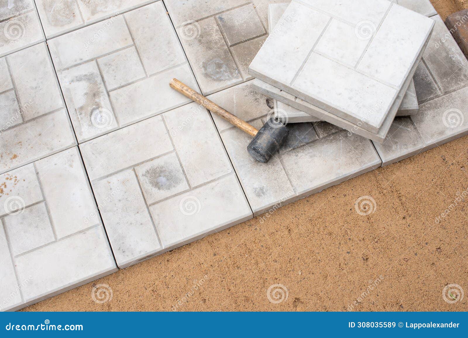 Scene of an Ongoing Pavement or Tile Installation. There is a Rubber ...