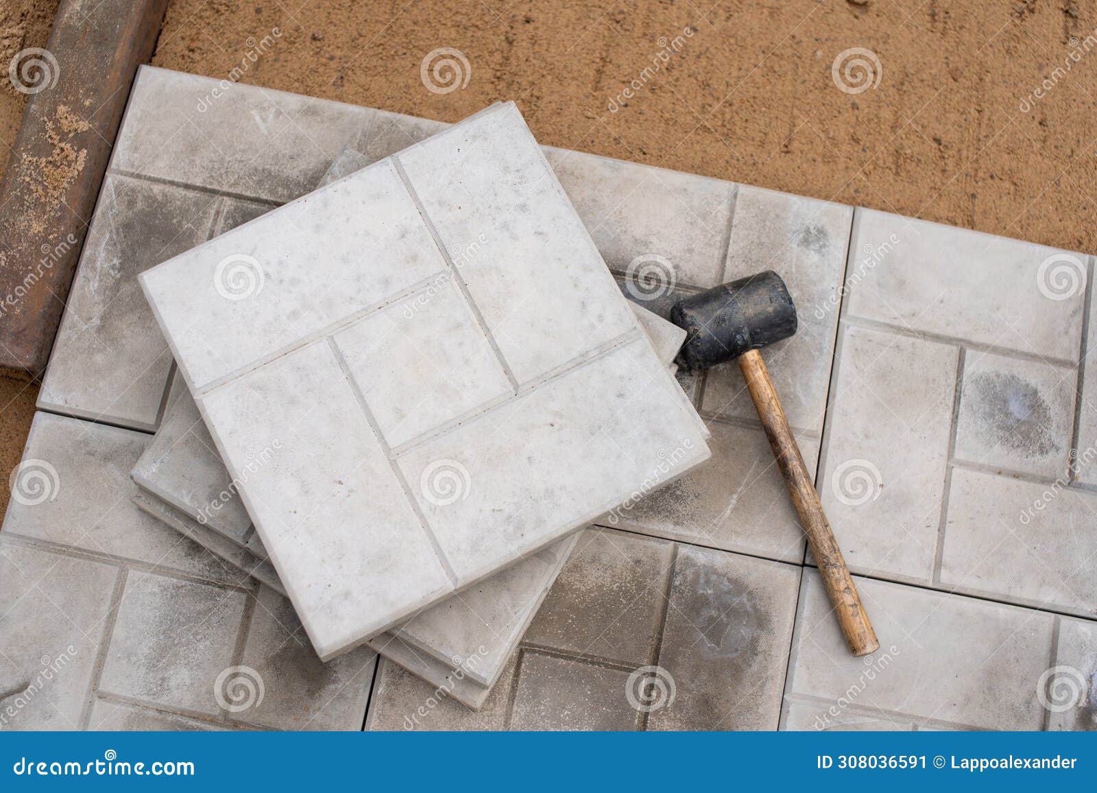 Scene of an Ongoing Pavement or Tile Installation. There is a Rubber ...