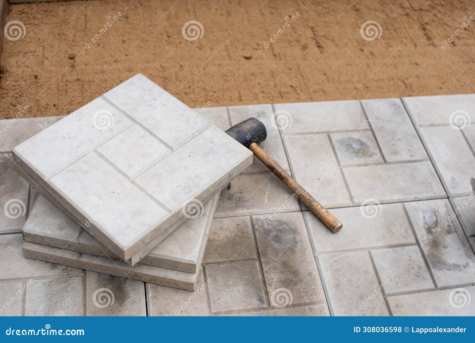 Scene of an Ongoing Pavement or Tile Installation. There is a Rubber ...
