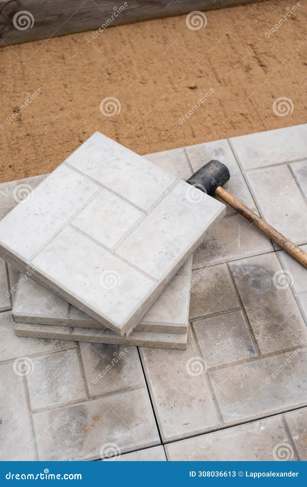 Scene of an Ongoing Pavement or Tile Installation. There is a Rubber ...