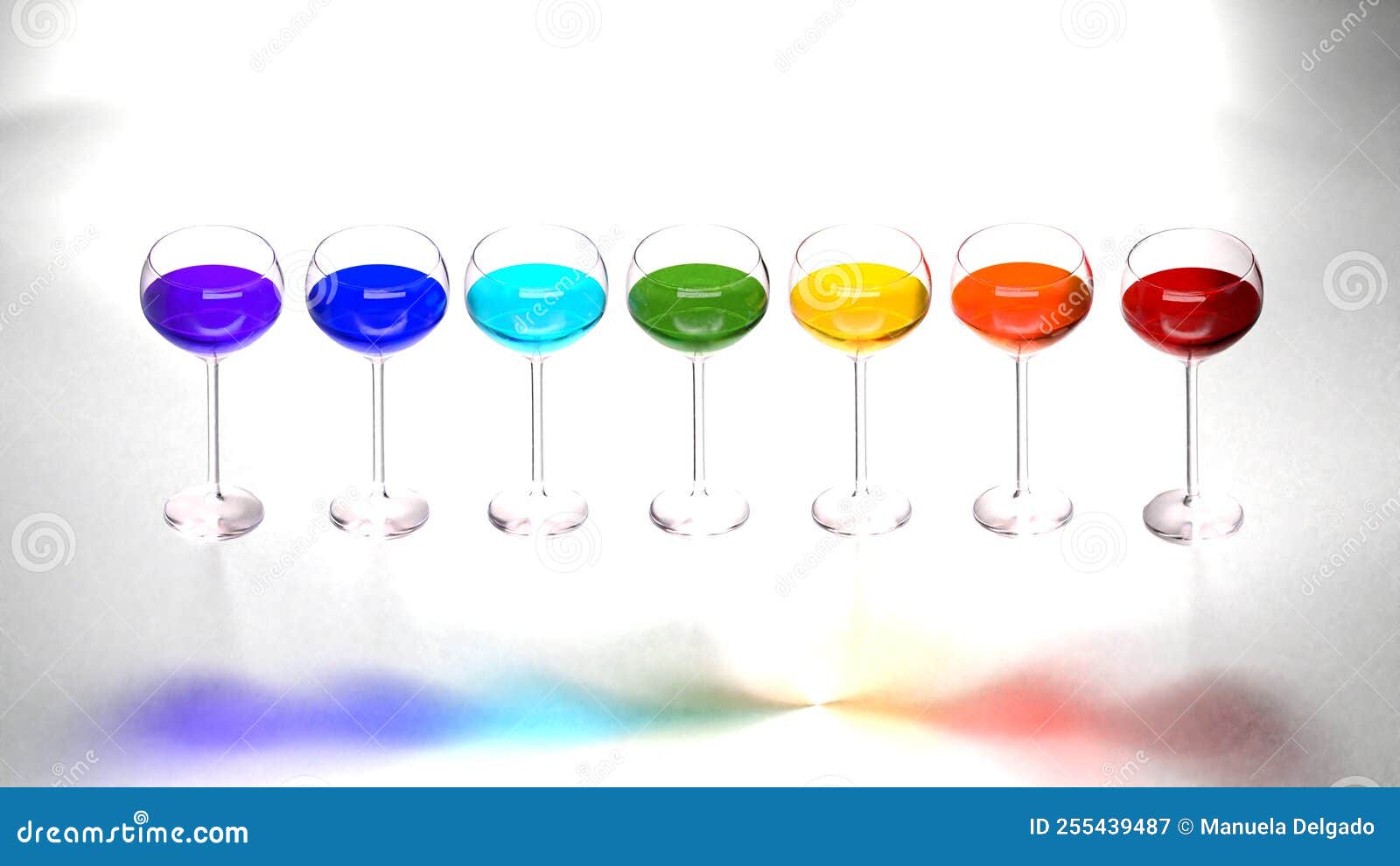 Seven Glass Cups with Liquid in Rainbow Colors Reflected on the Surface ...