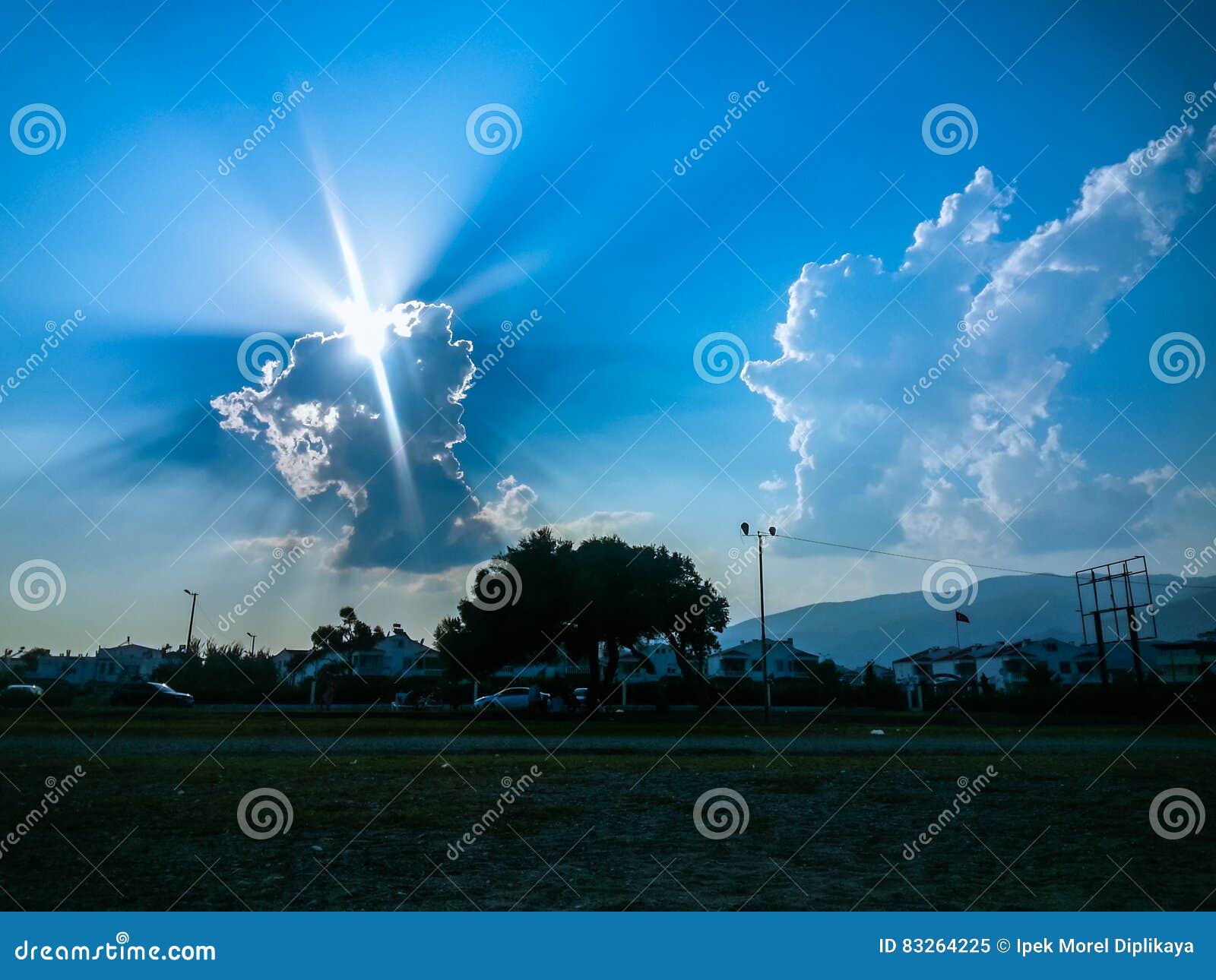 Scenery of Hidden Sun Behind the Clouds with a Tree Stock Image - Image ...