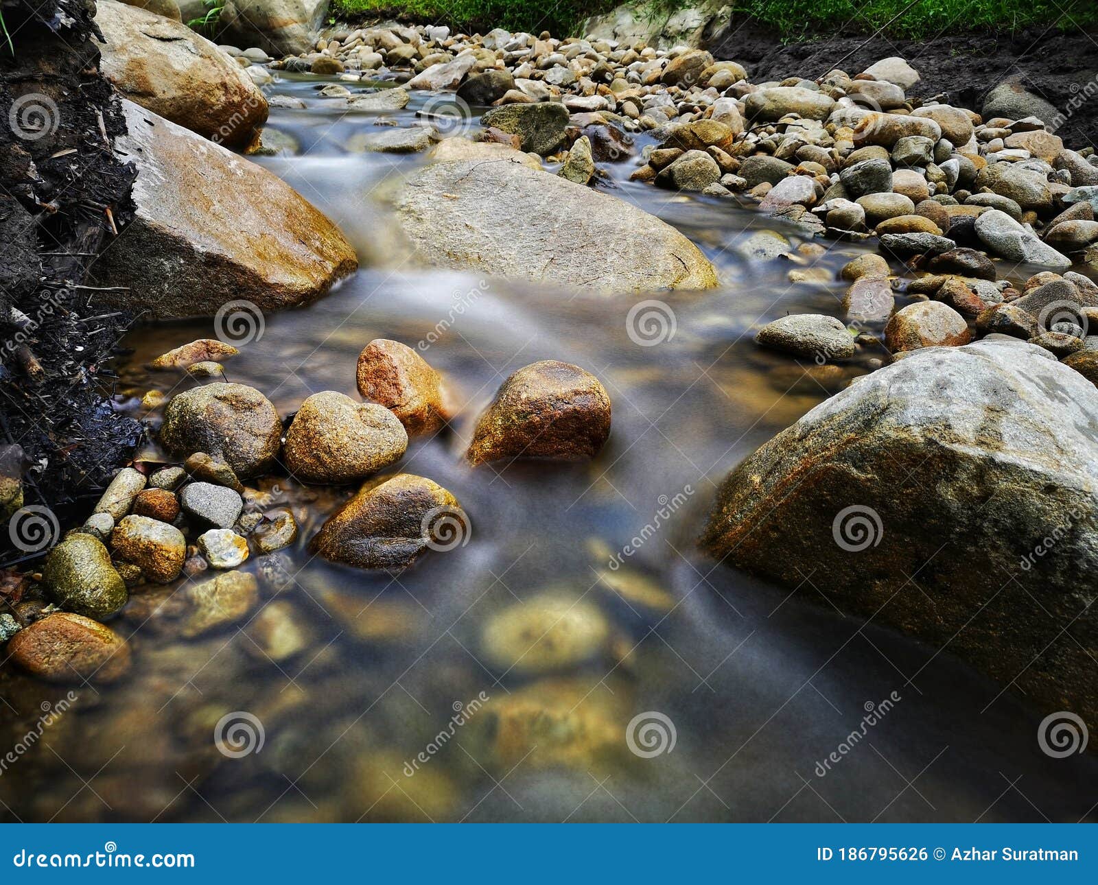 Scenery of River Stream Flowing between Rocks with Motion Blur Due To ...