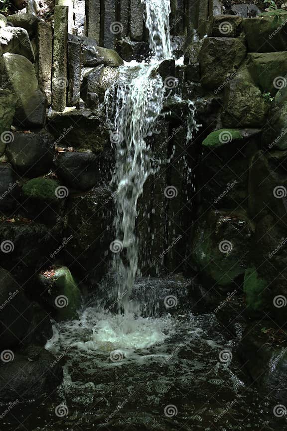 Scenery of Water Flowing from a Small Waterfall. Waterfall Background ...