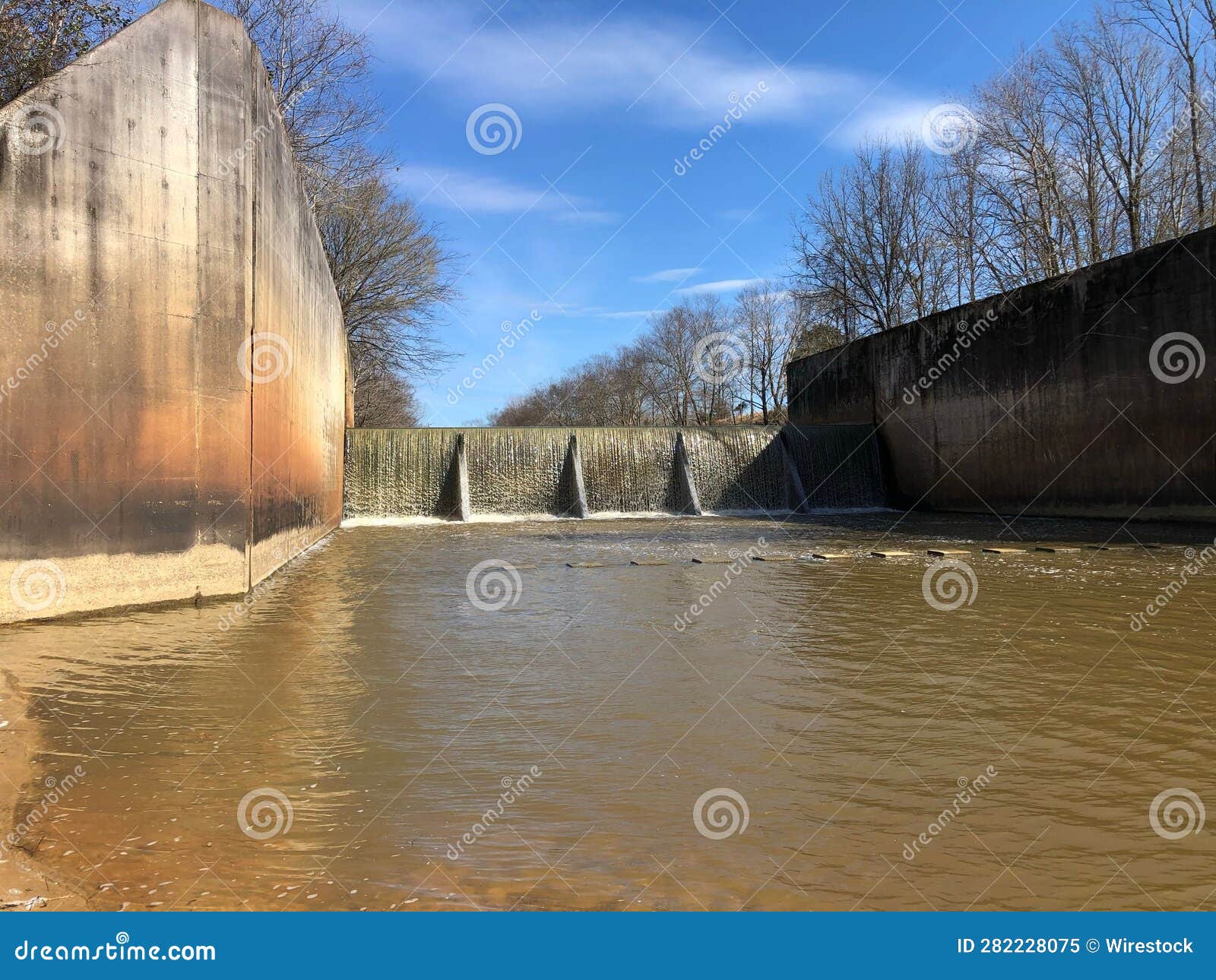 Scenic Aerial View of a Body of Water Held Back by a Dam Structure ...