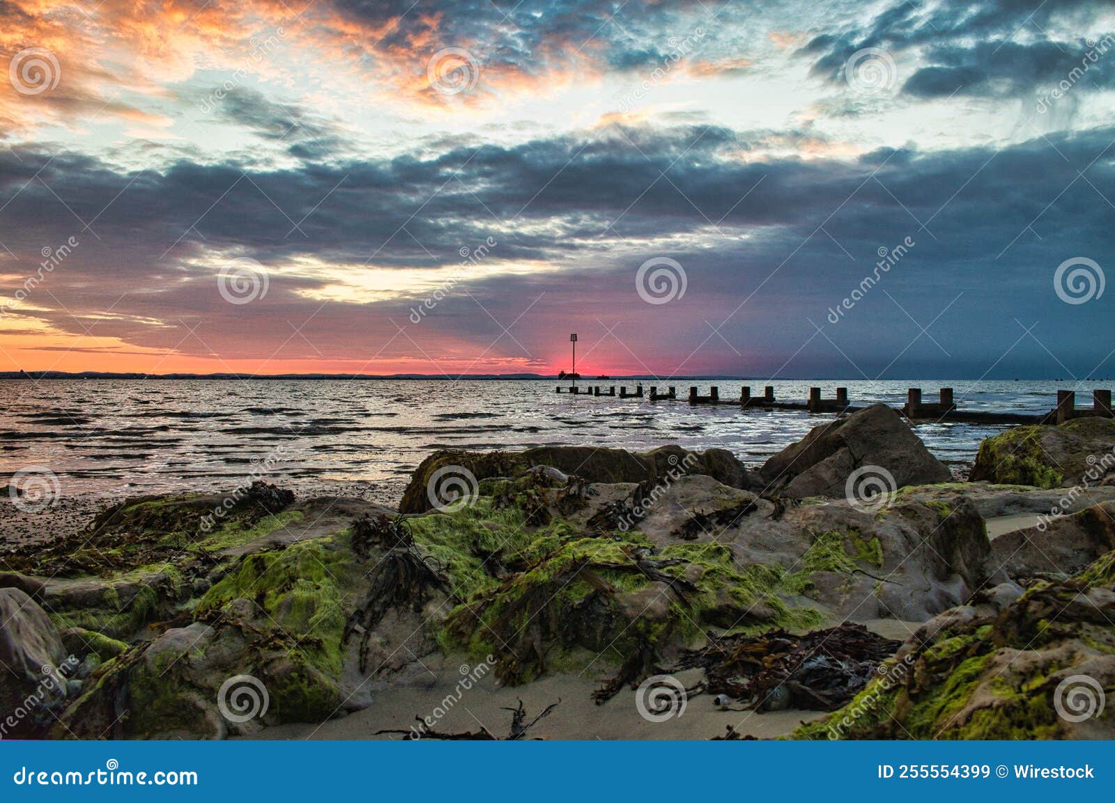 Scenic Beach with Big Rocks during a Dramatic Sunset Stock Image ...