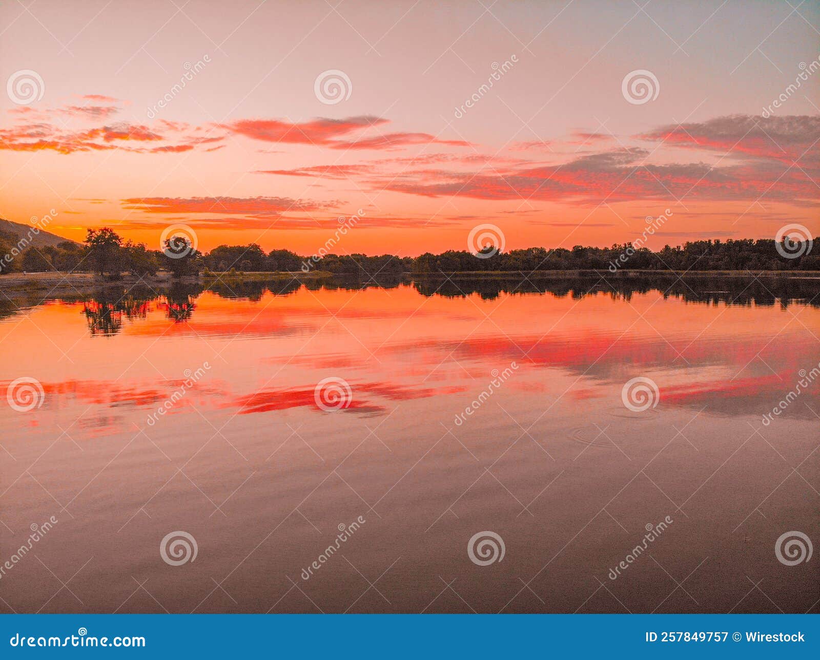 Dramatic Sunset Over a Waterscape with Reflection Stock Image - Image ...