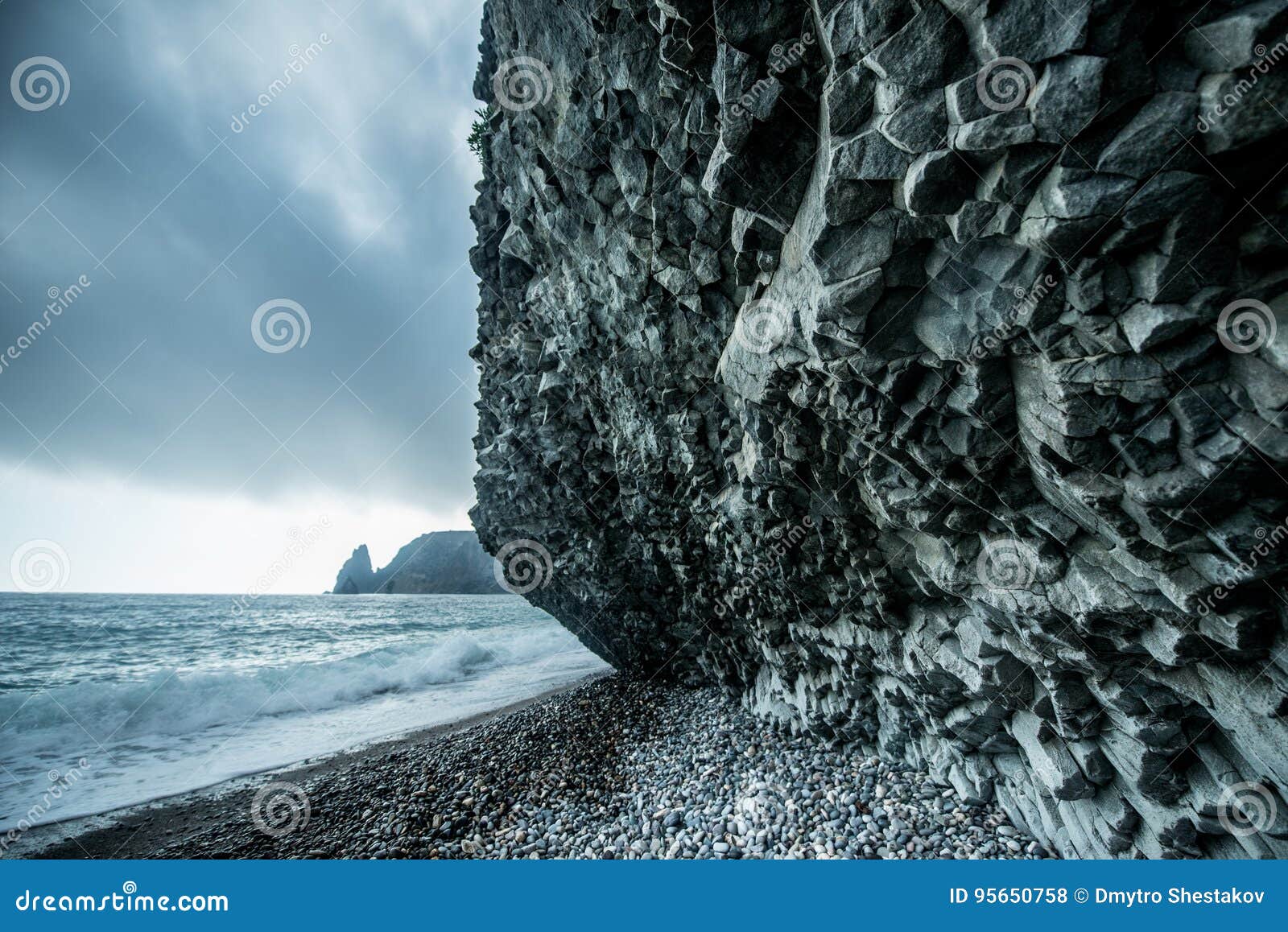 Scenic Graphite Rock at the Seashore in Cloudy Weather Stock Photo ...