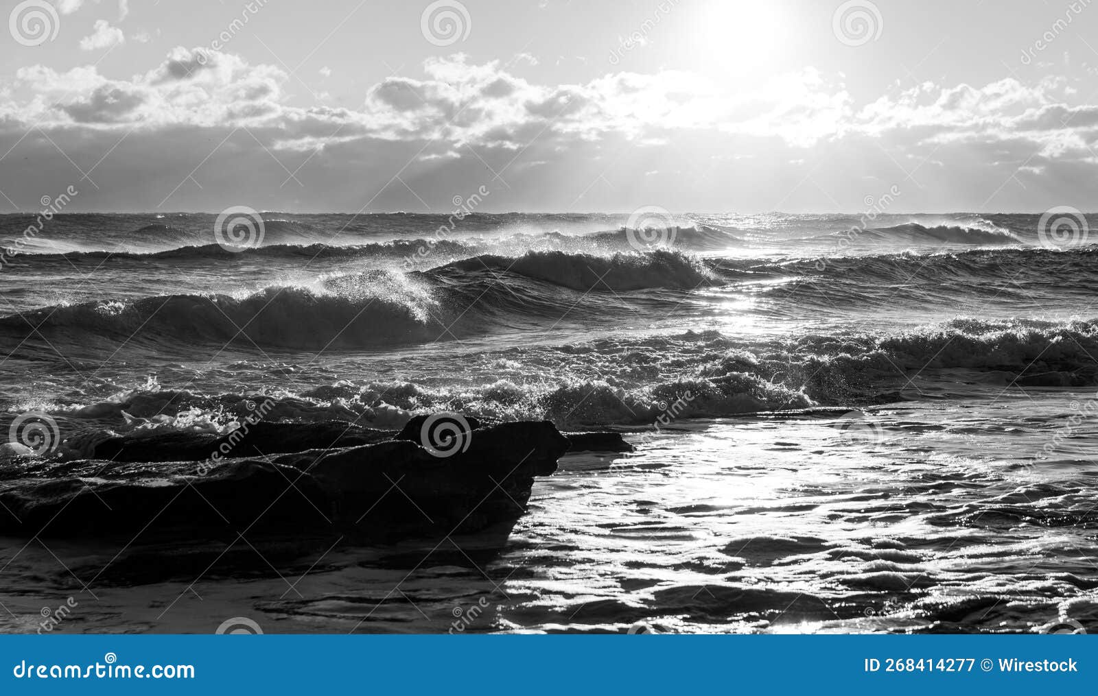 Scenic Grayscale View of Ocean Waves Reaching the Shore at Sunset Stock ...