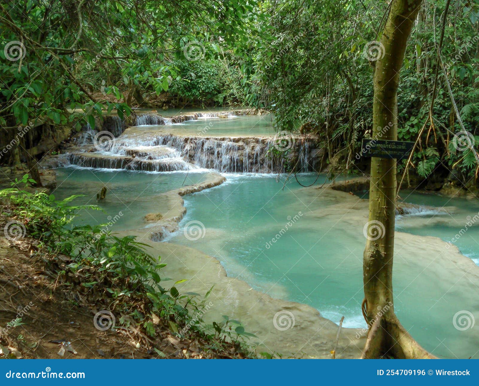 Scenic Kuang Si Waterfall with Teal Water in Laos Stock Photo - Image ...