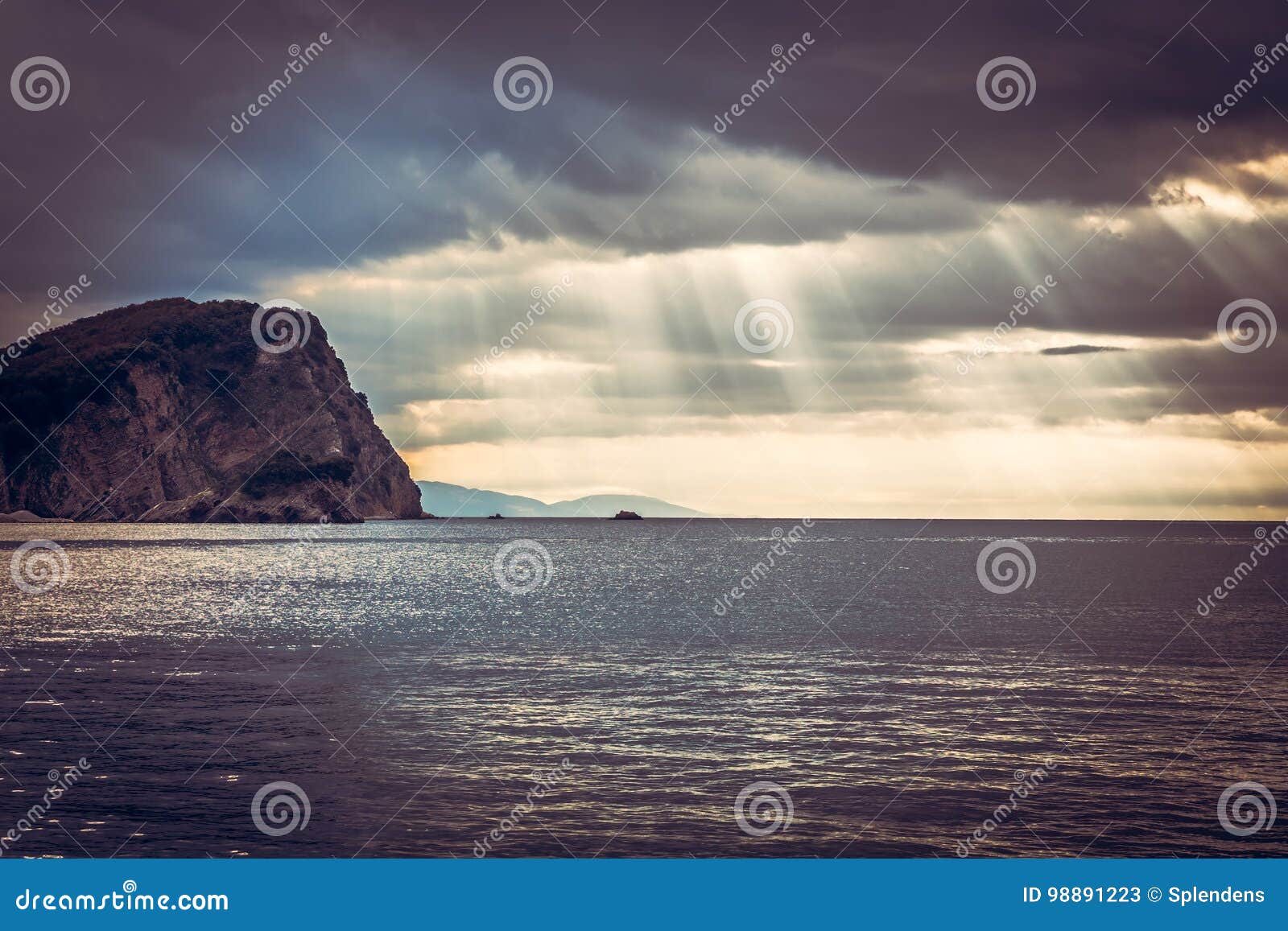 Scenic Landscape with Cliff Rock at Sea during Sunset with Sun Rays ...
