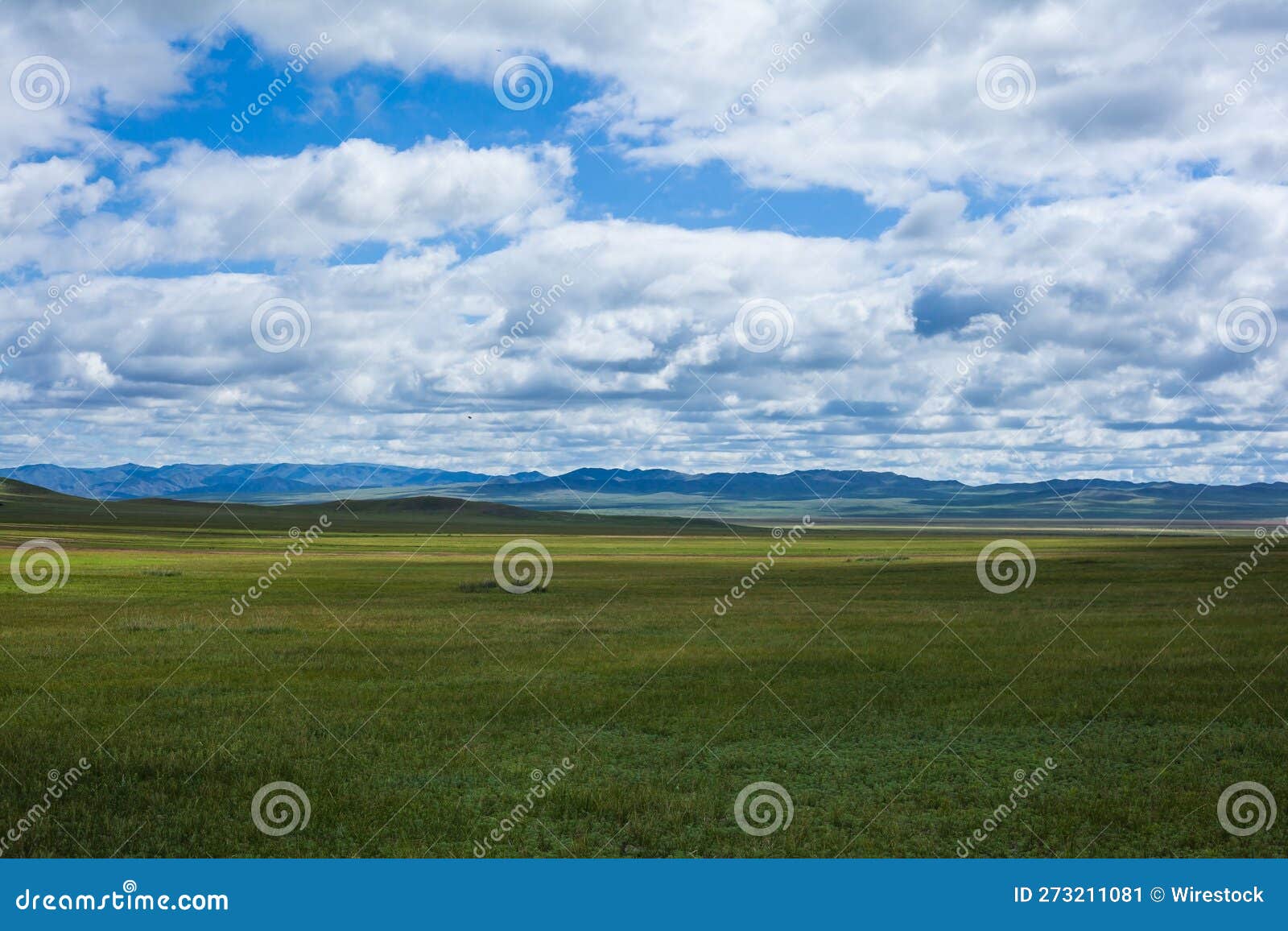 Scenic Landscape Featuring Rolling Fields with a Few Scattered Clouds ...
